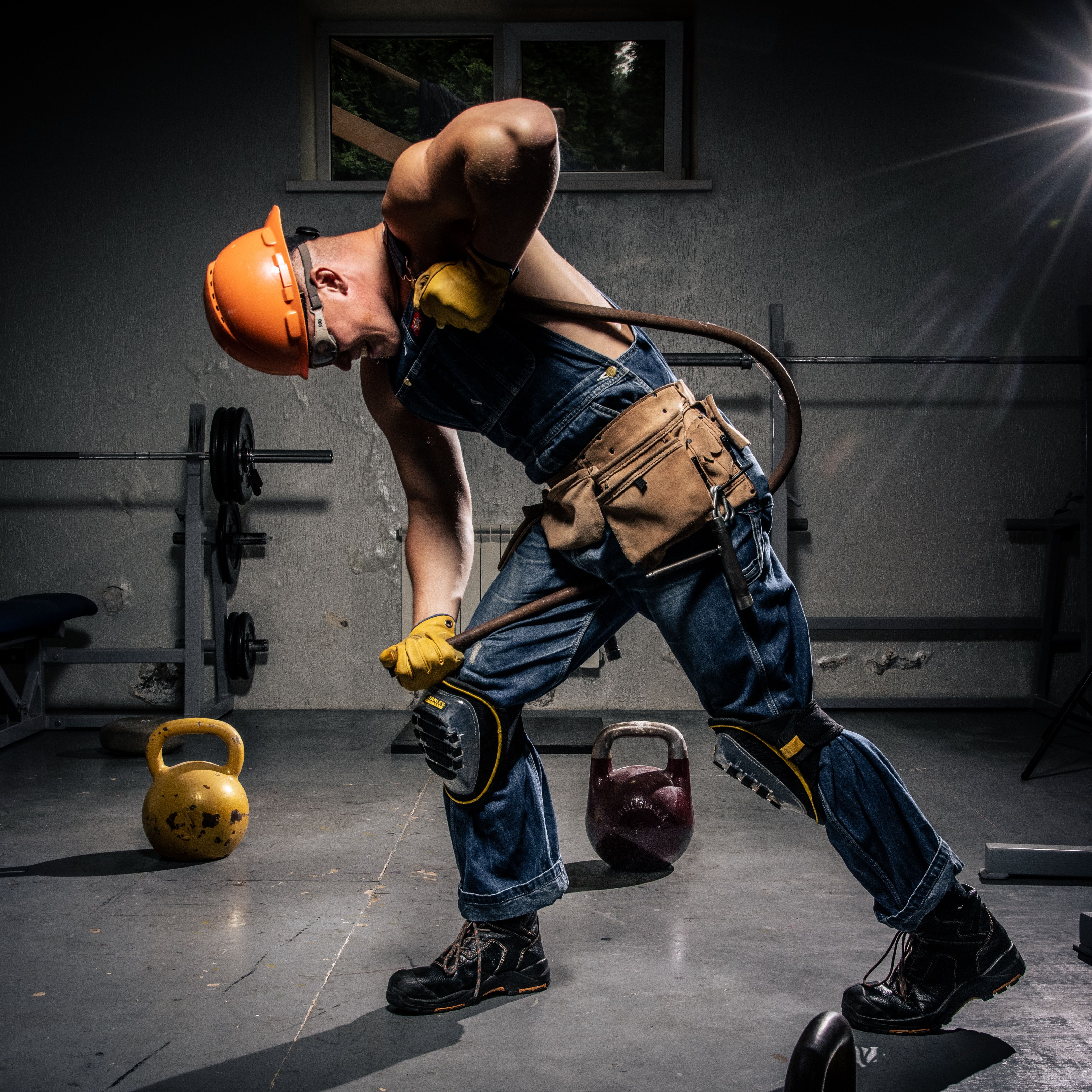 Man in Worker Helmet at Gym · Free Stock Photo
