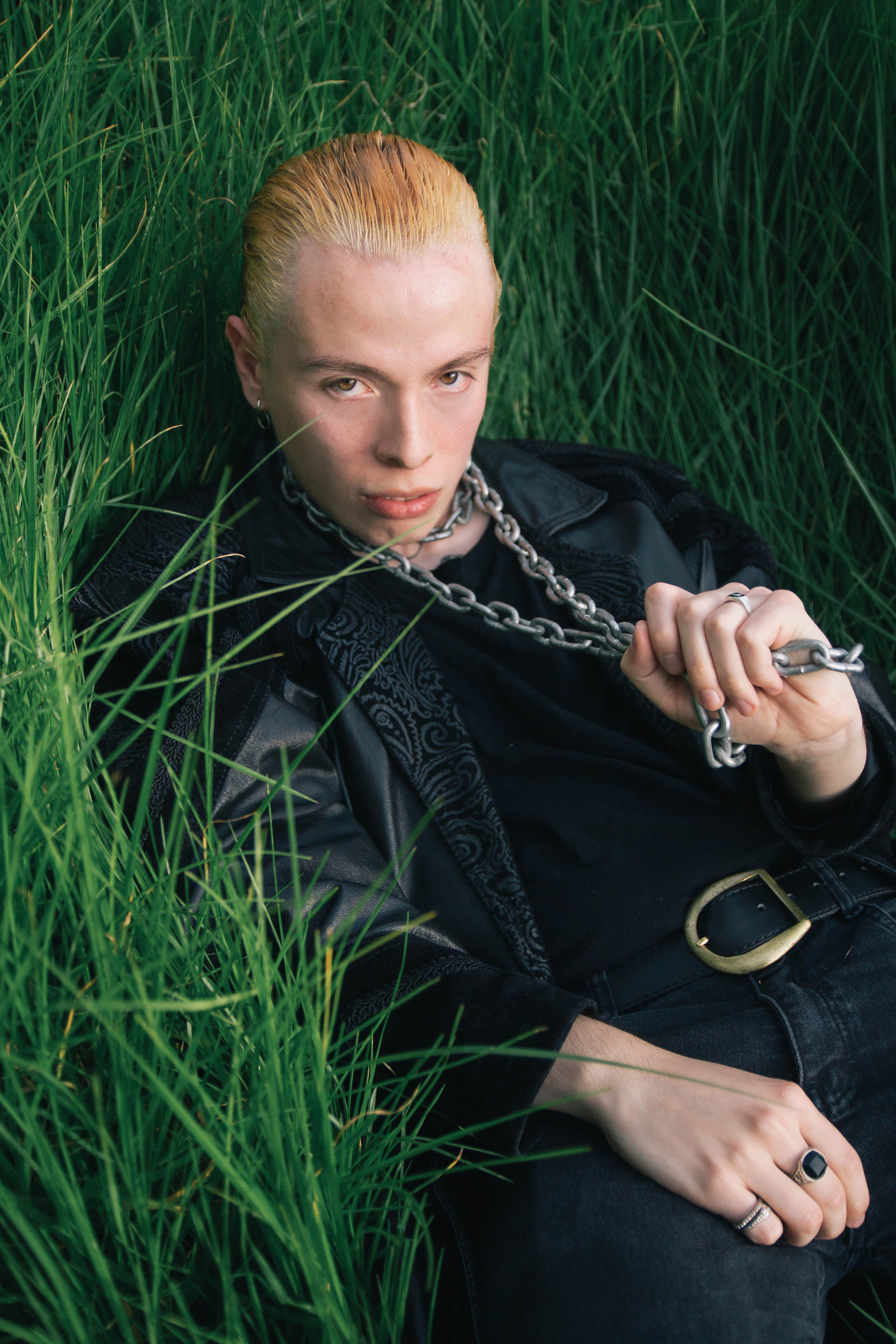 Man in Black Leather Jacket and Leopard Print Shirt Smoking a Cigarette ...