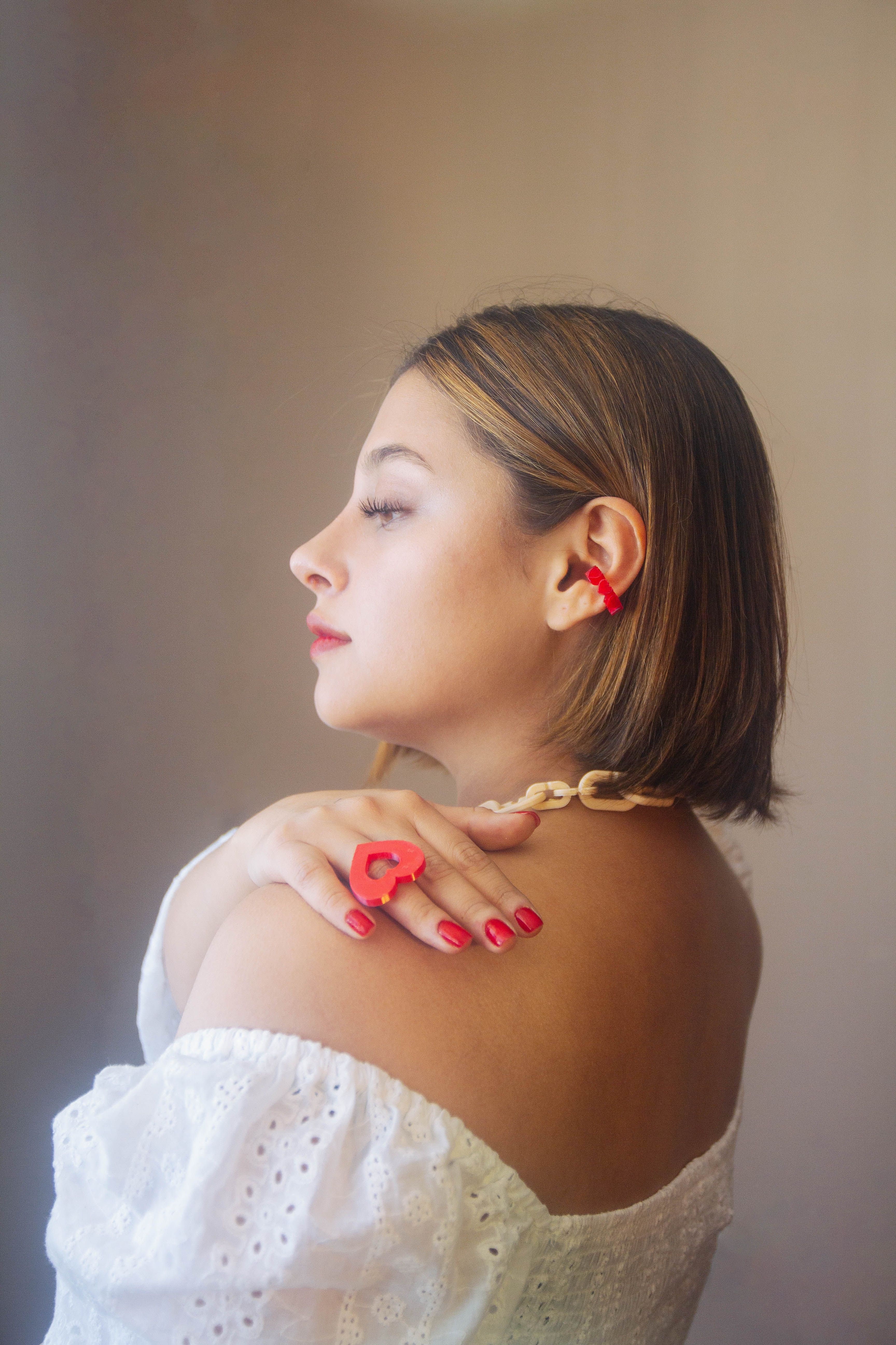 Young Woman Wearing Red Jewelry · Free Stock Photo
