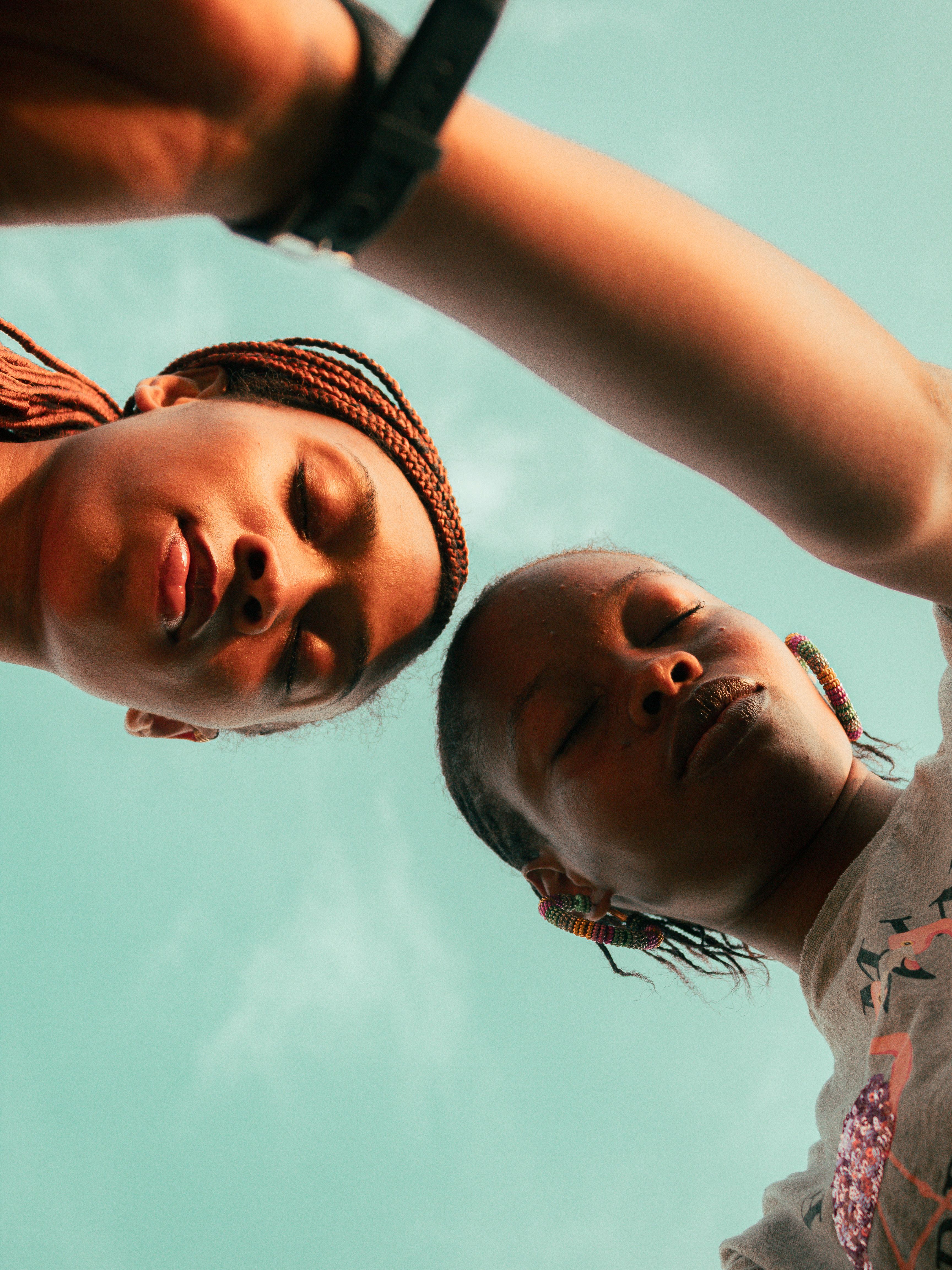 Women Holding Hands and Posing · Free Stock Photo