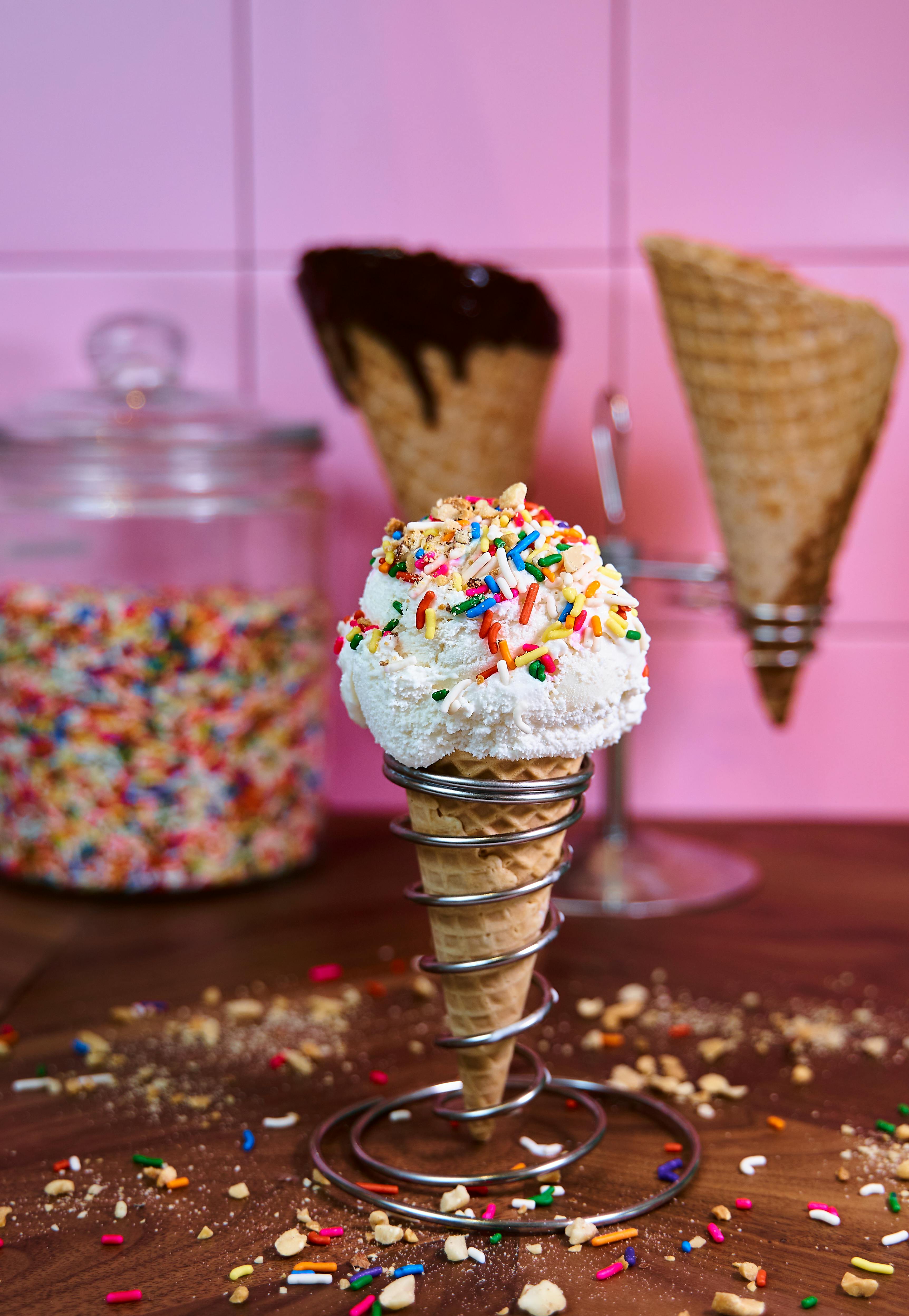 Man Holding Ice Cream Cone Under Cloud · Free Stock Photo
