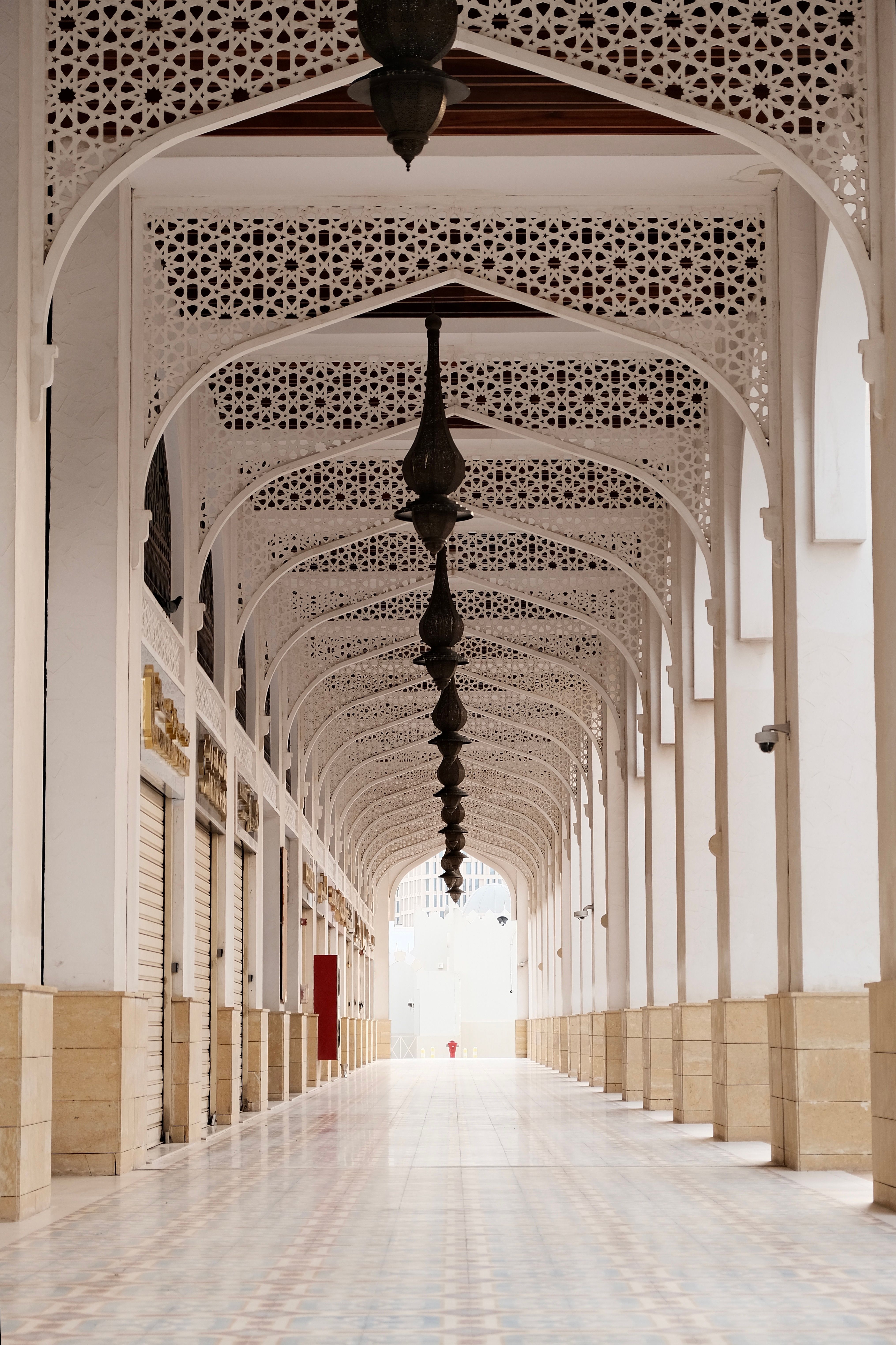 Decorated Corridor among Columns · Free Stock Photo