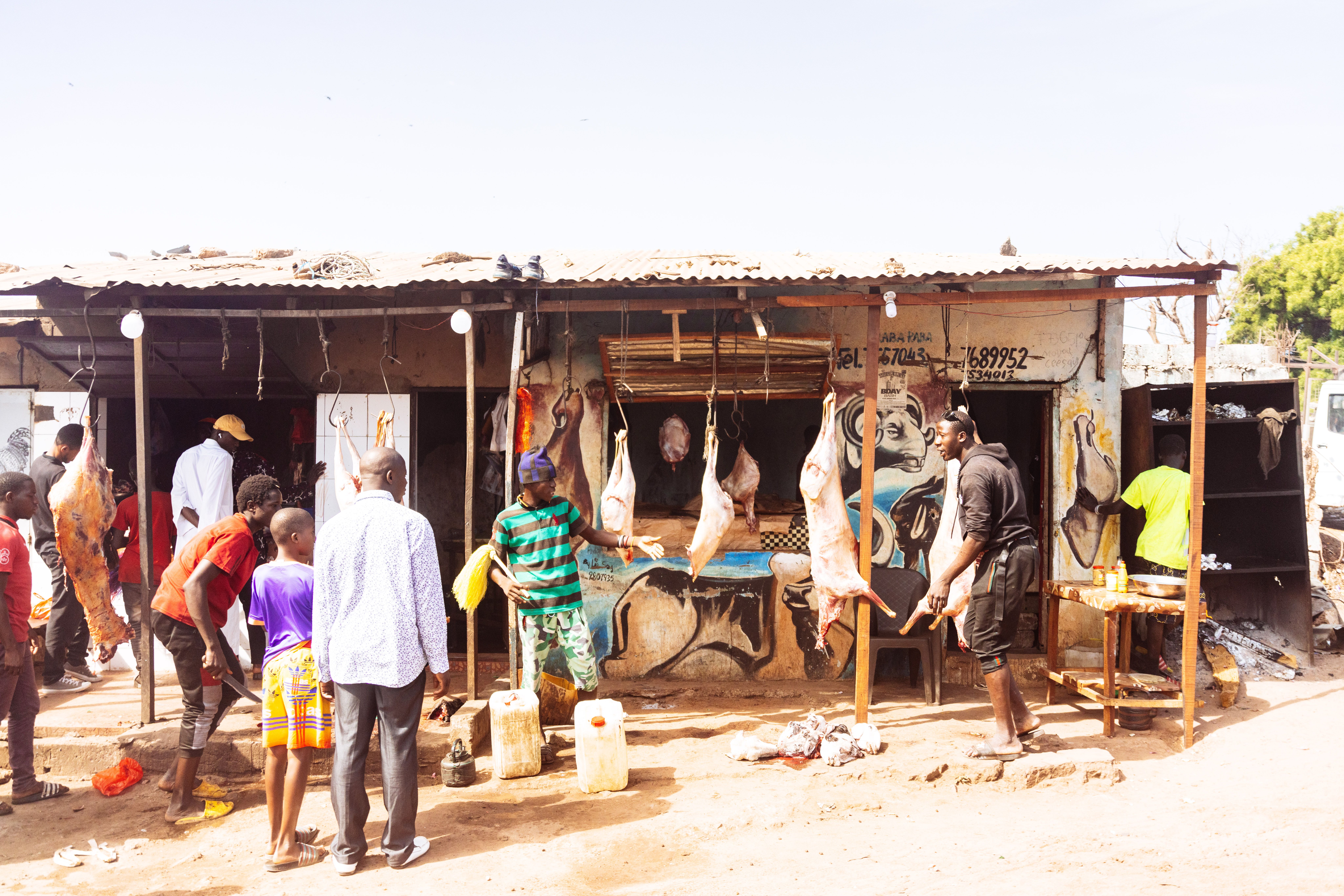 People Standing near House in Village · Free Stock Photo