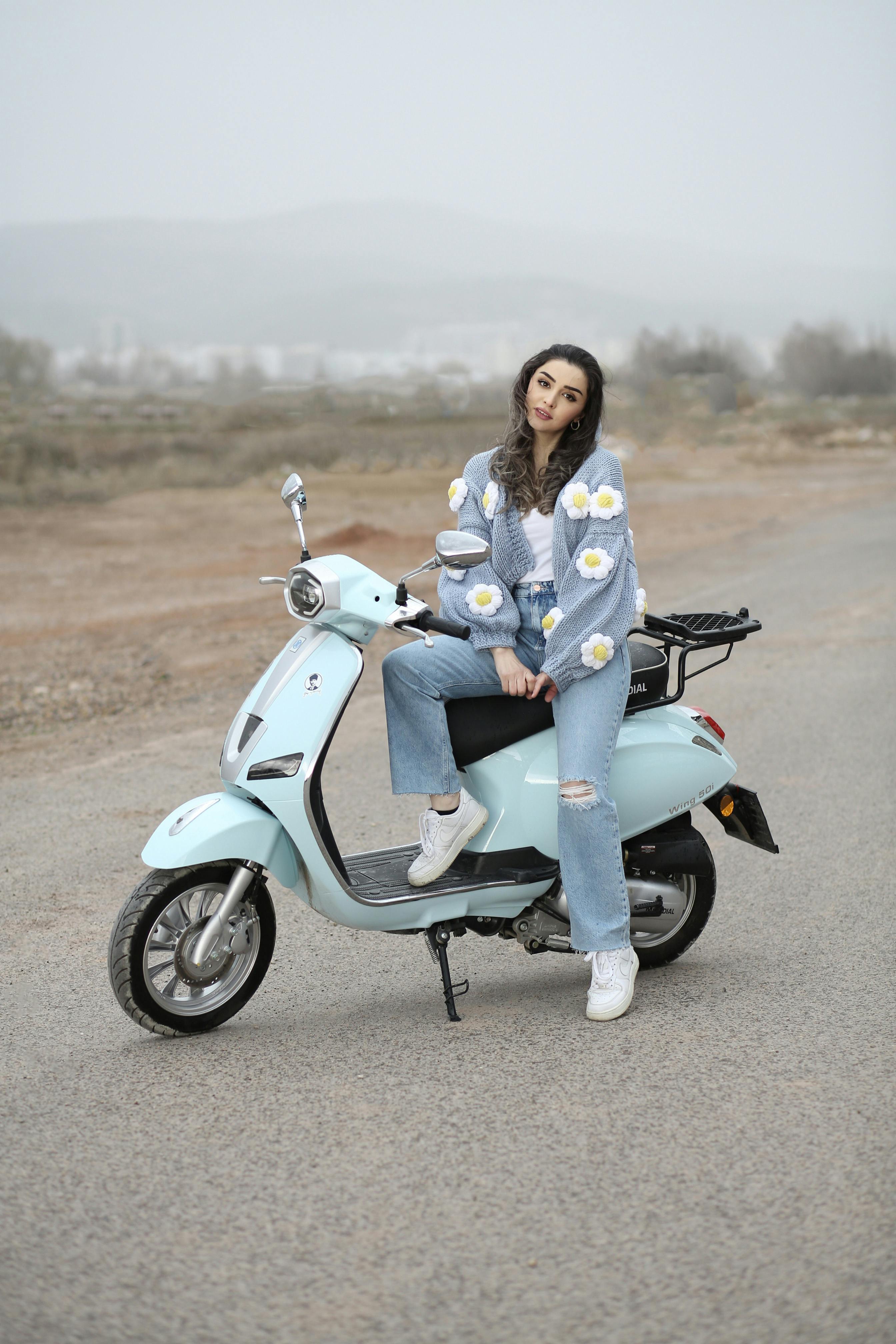 Woman Posing on Scooter on Road · Free Stock Photo