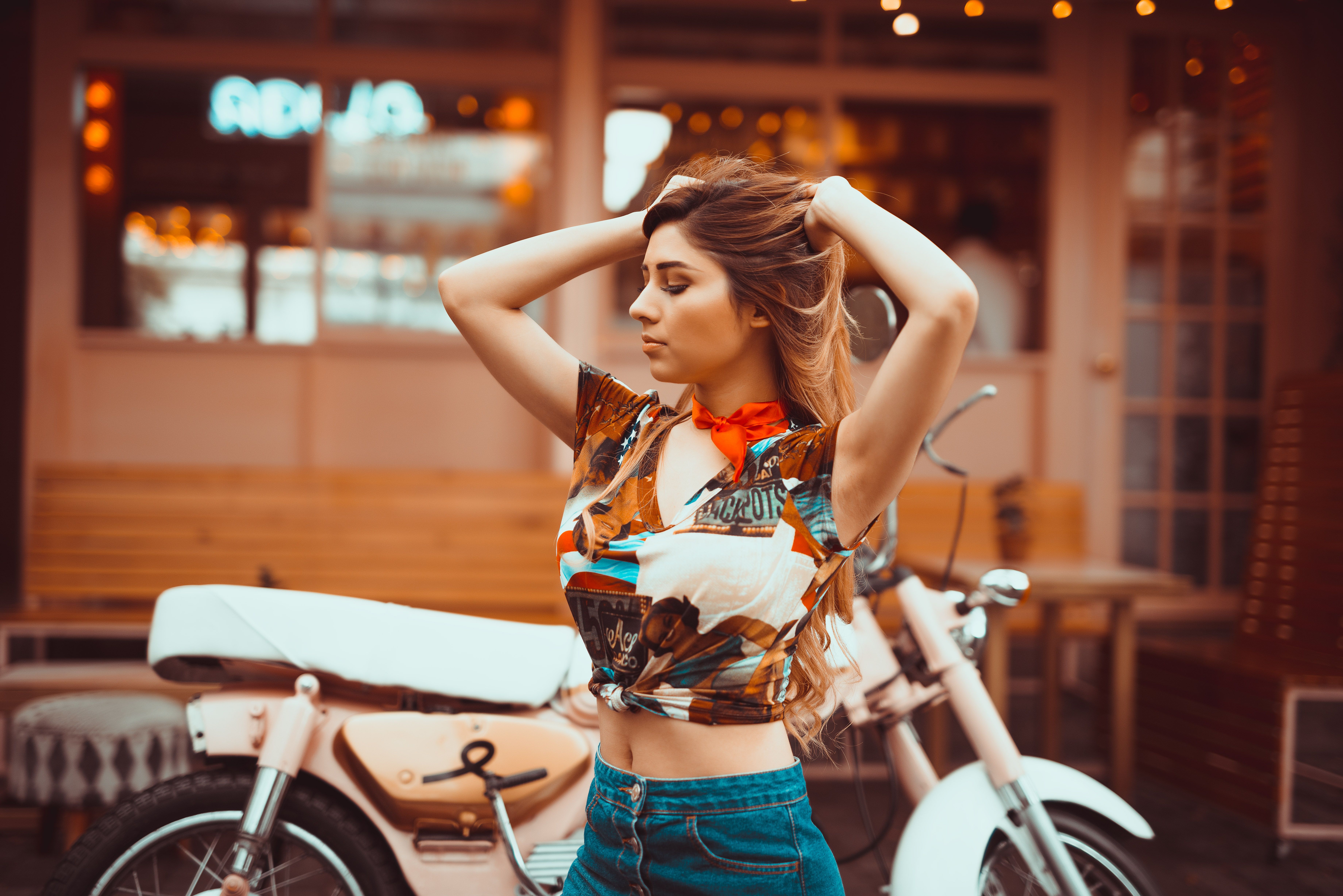 Young Posing in front of a Vintage Motorcycle and a Building · Free ...