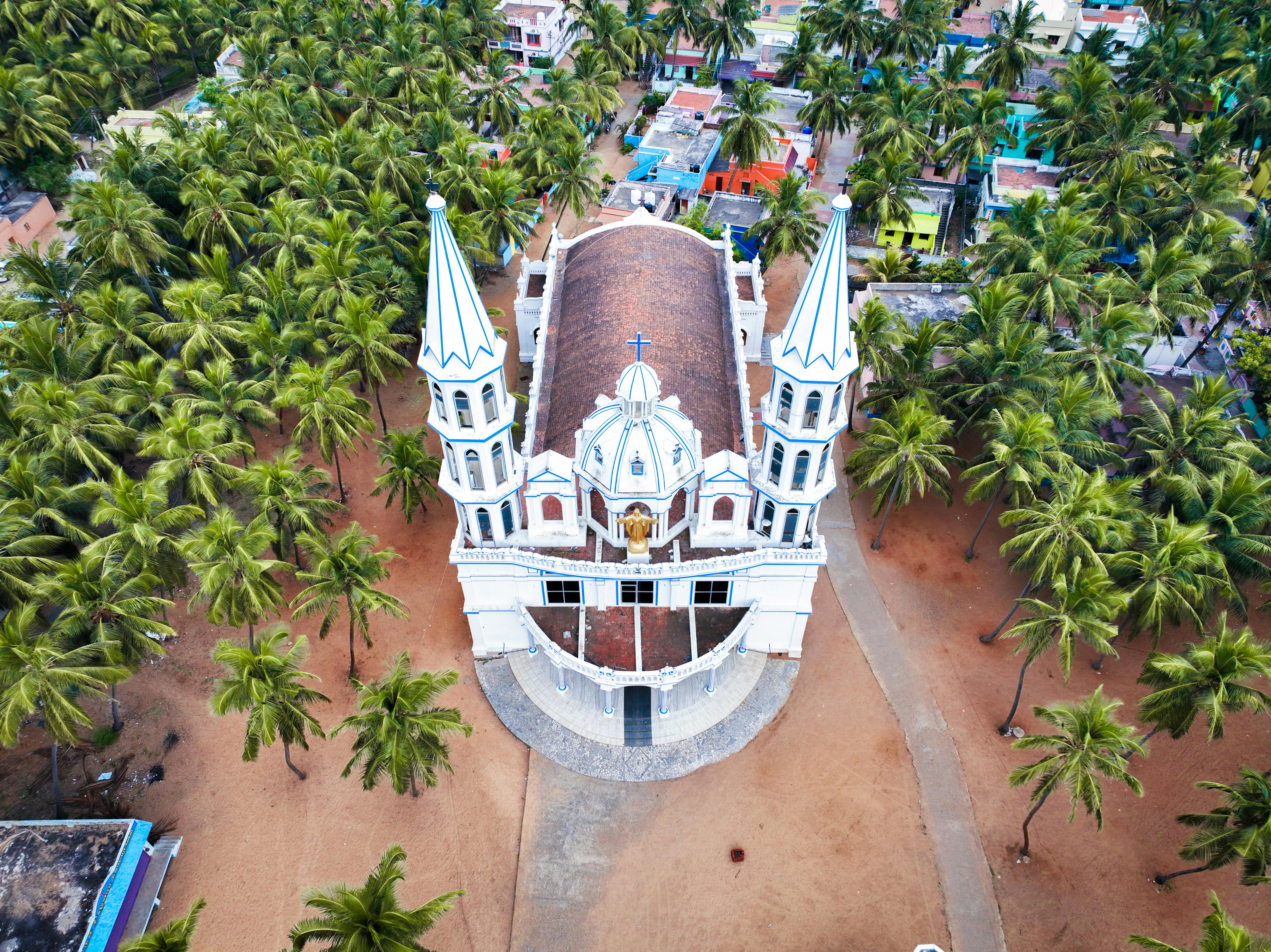 Palm Trees around Church Building · Free Stock Photo