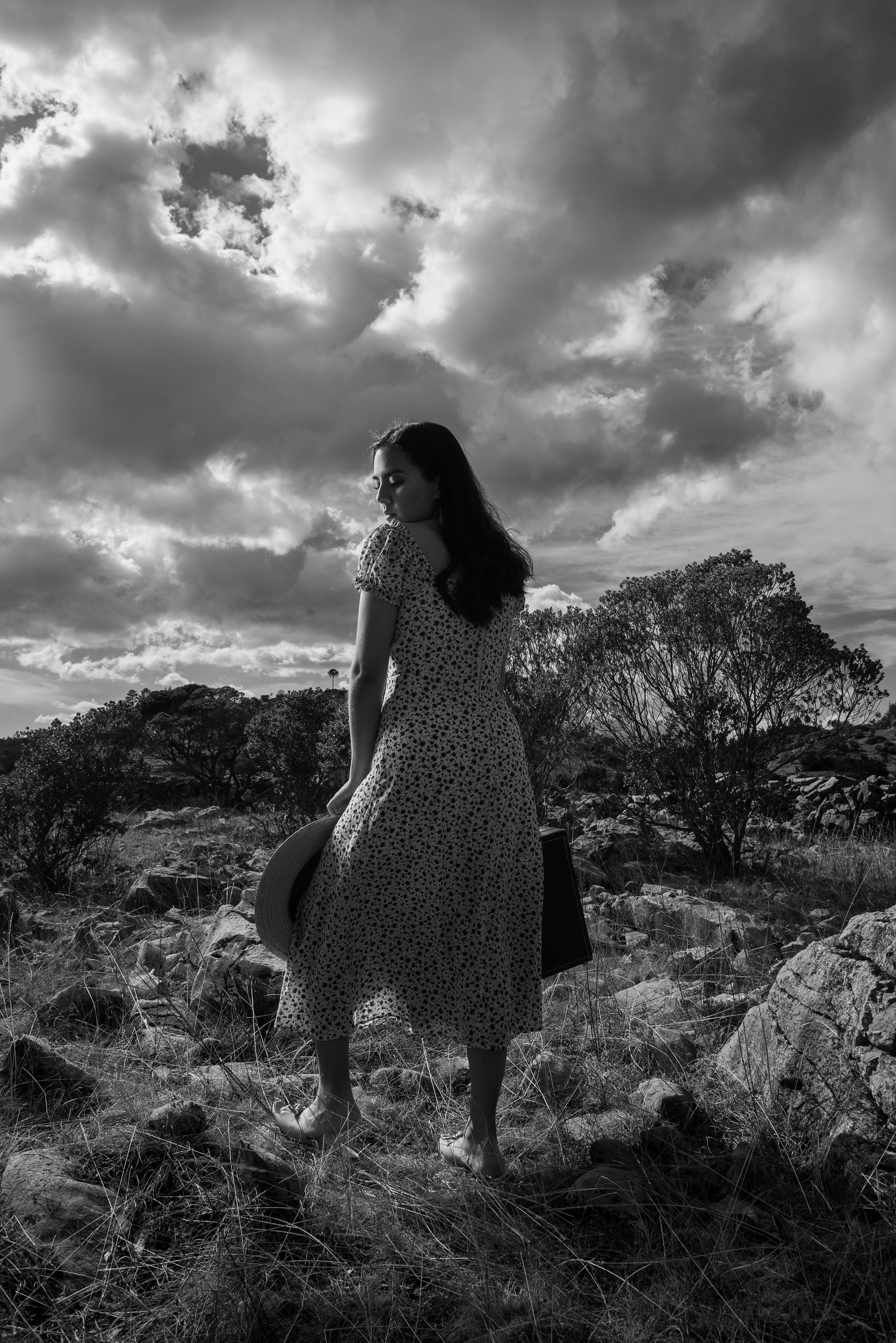 Woman Posing under Dramatic Sky · Free Stock Photo