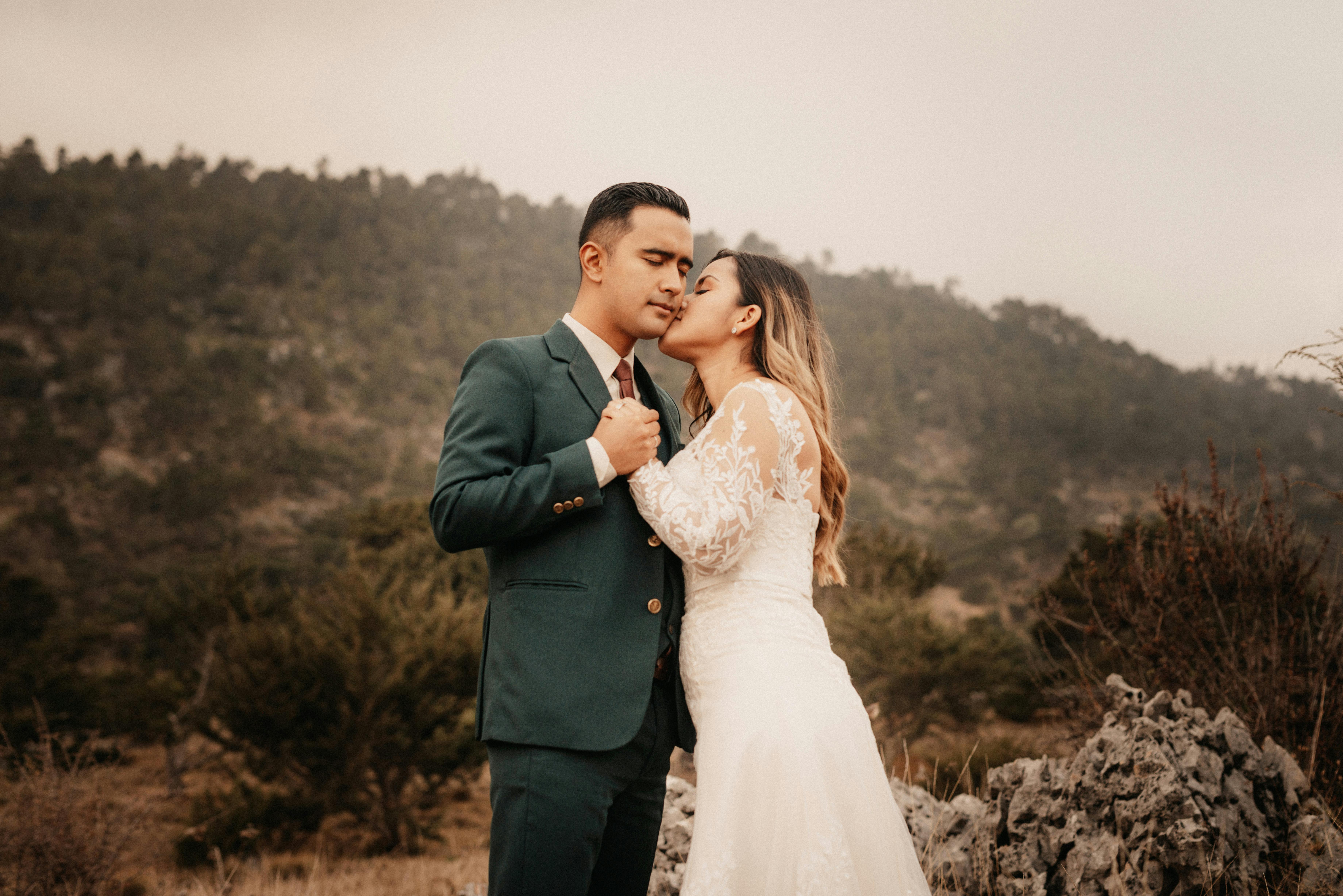 Bride Kissing Groom · Free Stock Photo