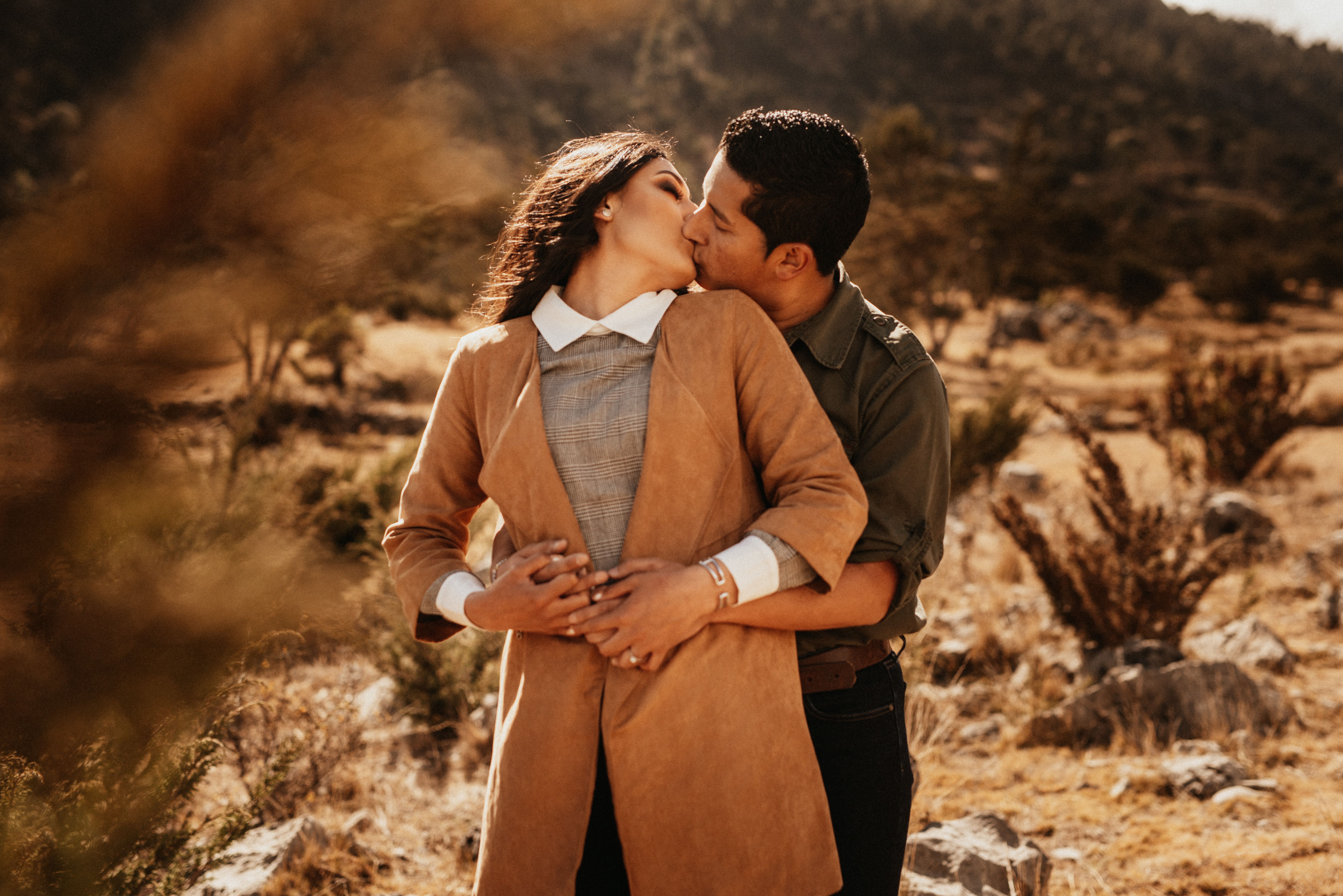 Kissing Couple Holding Hands · Free Stock Photo