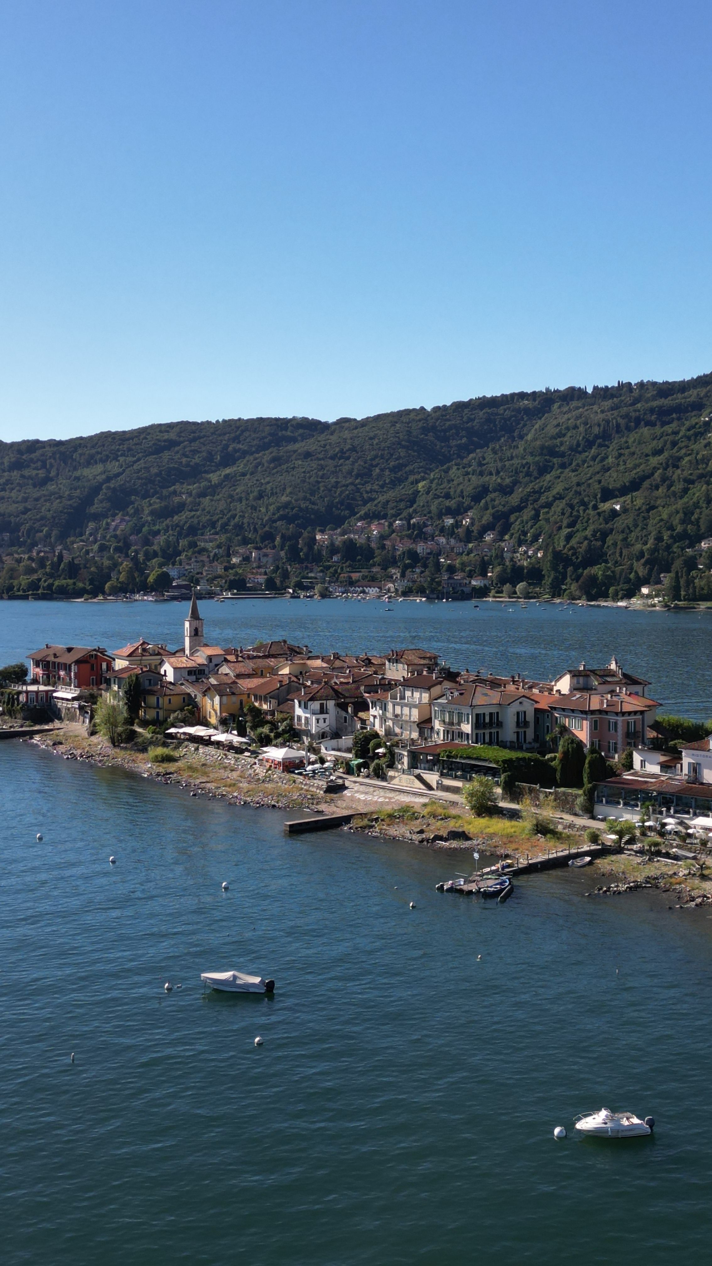 Motorboat Sailing on Lake Como Surrounded by Alps · Free Stock Photo