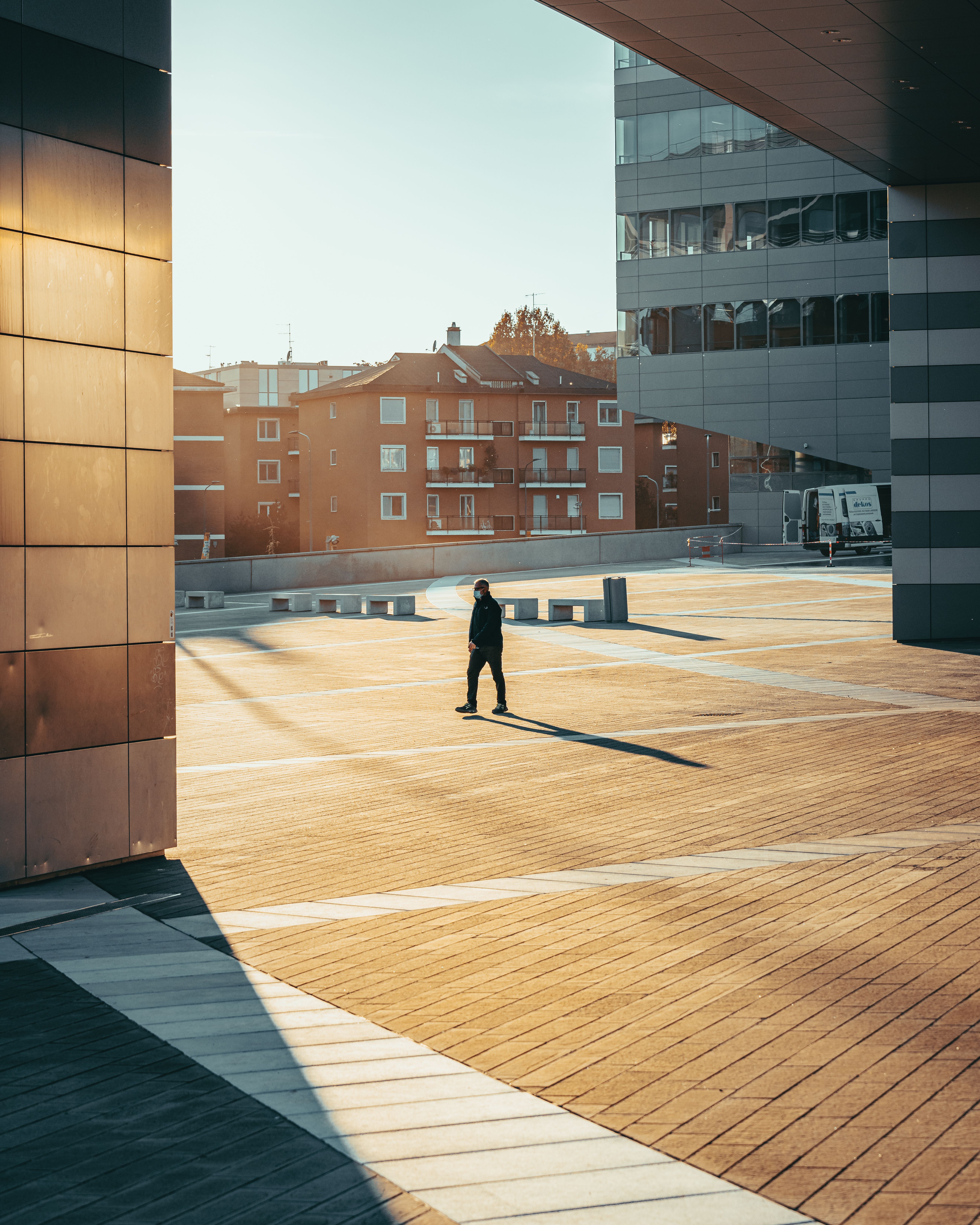 Man Walking on Square in City · Free Stock Photo