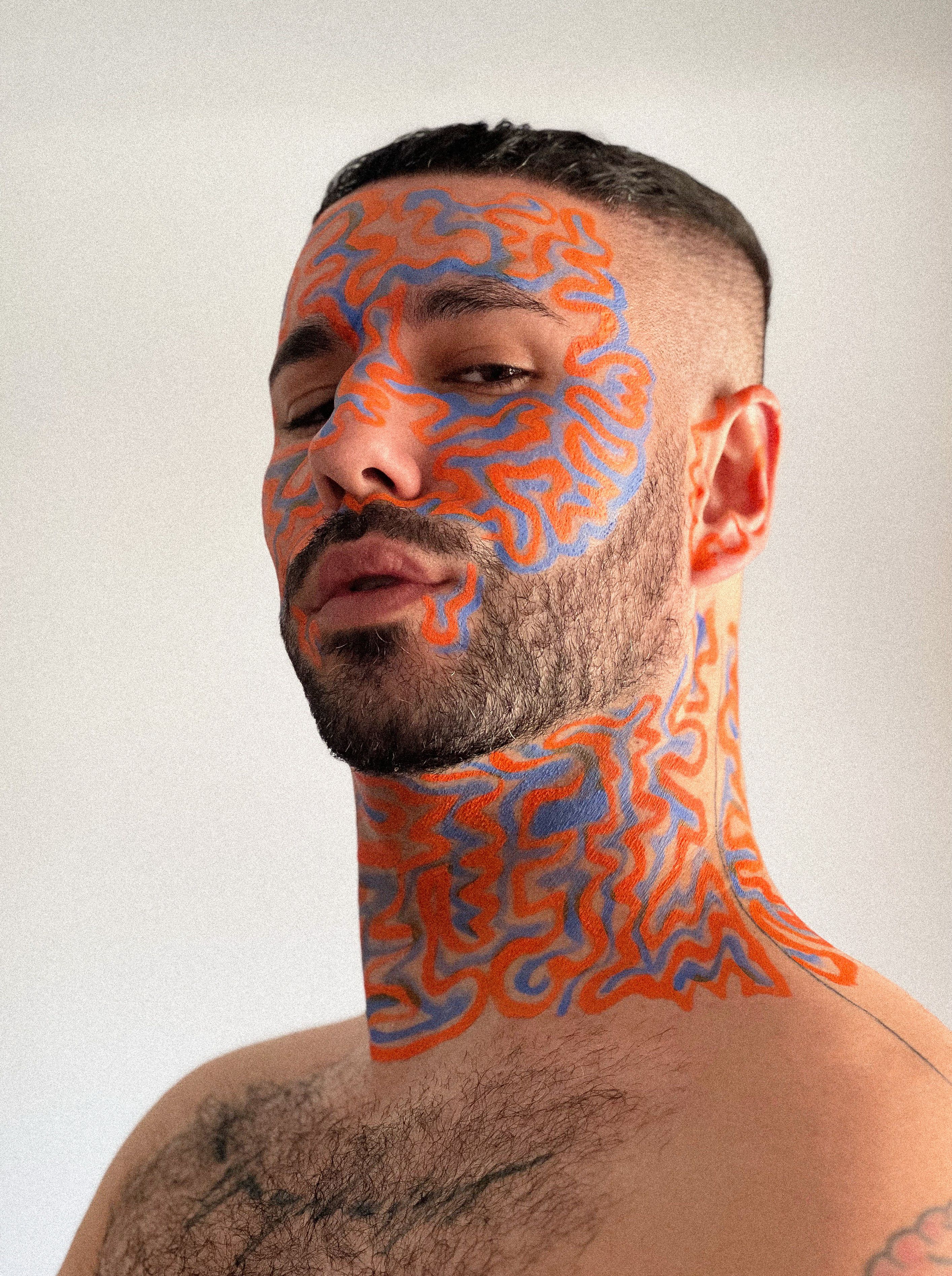 Man with Tattoos on Neck and Face · Free Stock Photo