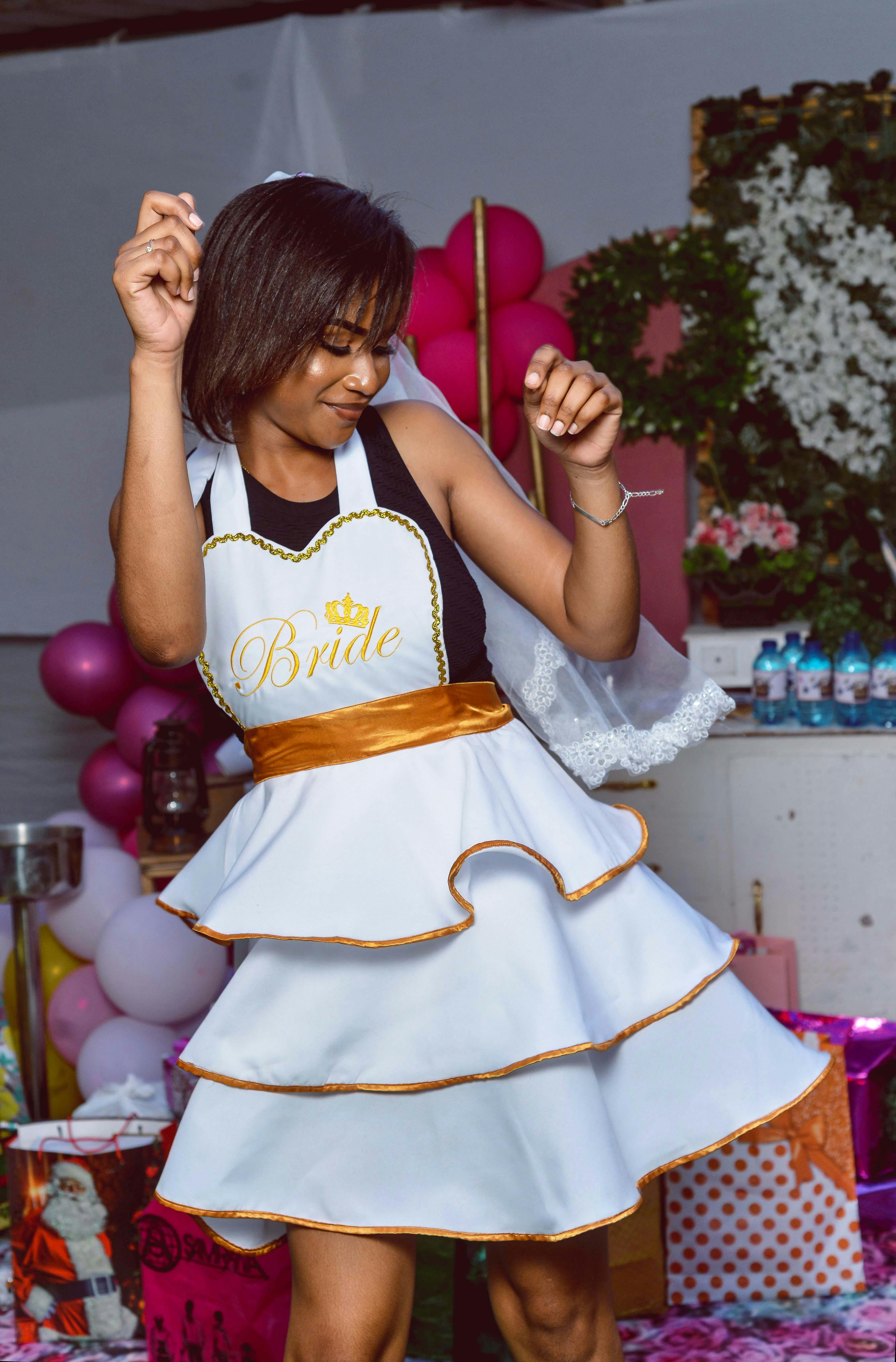 Woman in a White Apron Dancing · Free Stock Photo