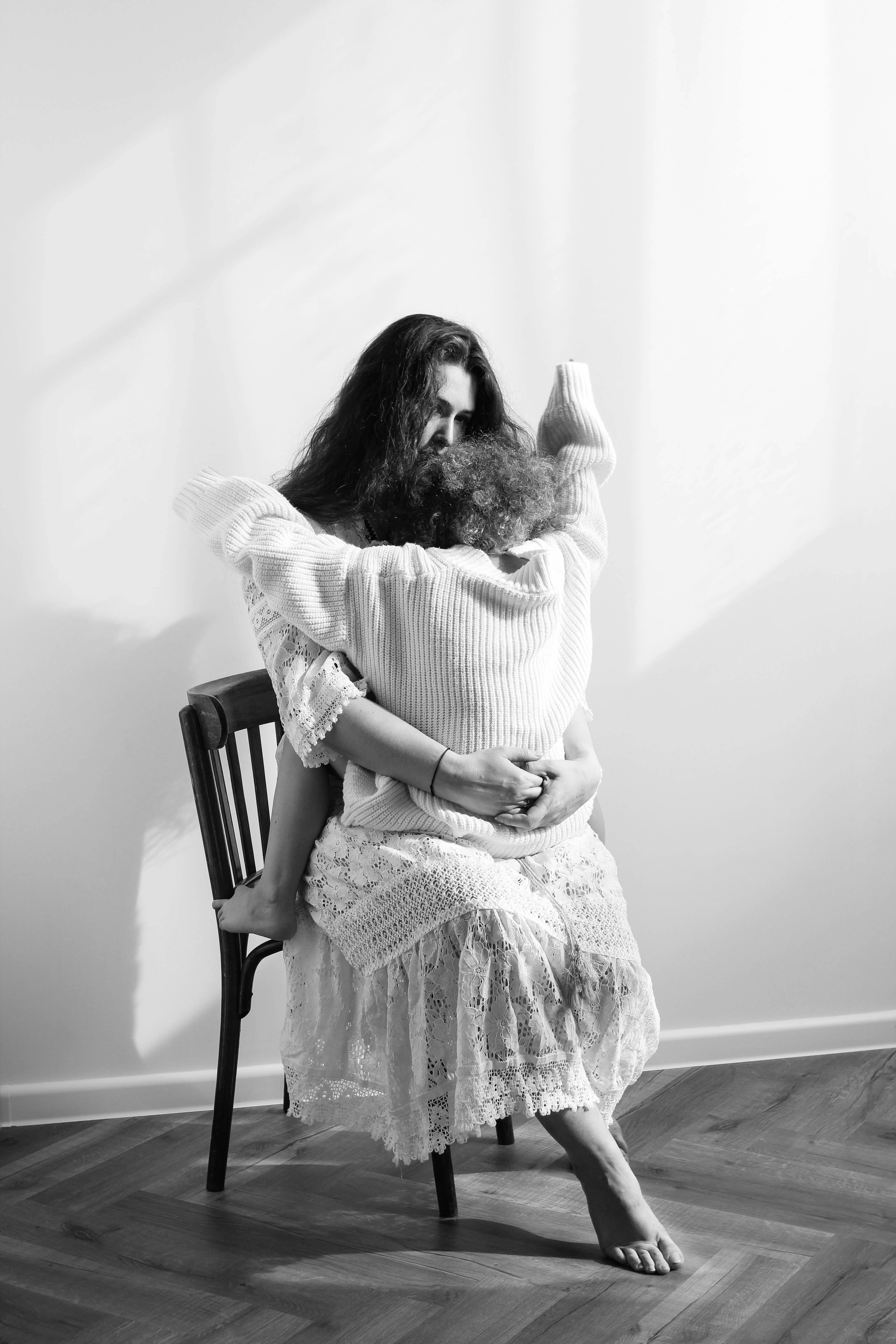 A Woman Sitting on Floor Hugging Leg · Free Stock Photo