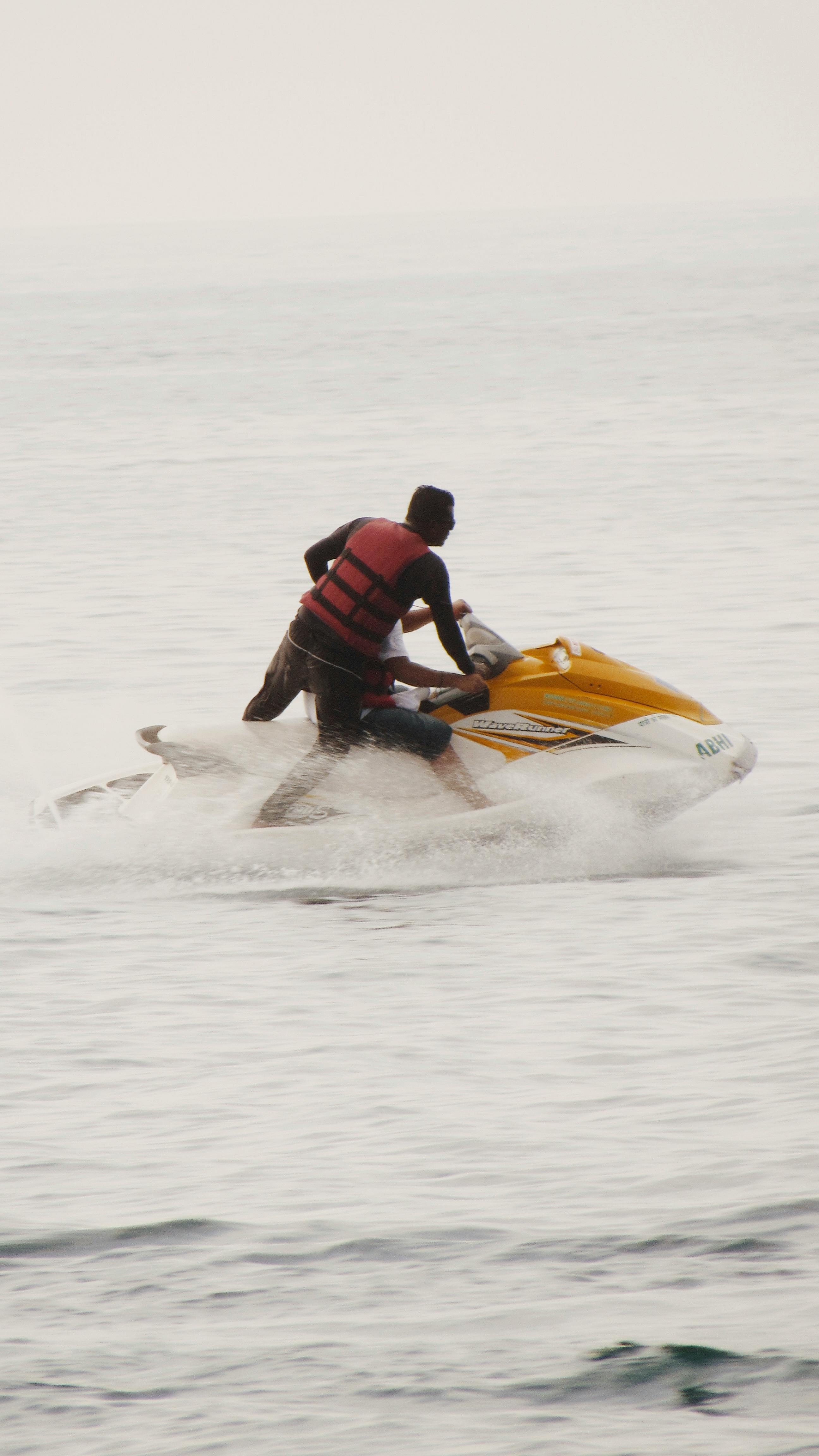 People Riding A Jet Ski · Free Stock Photo