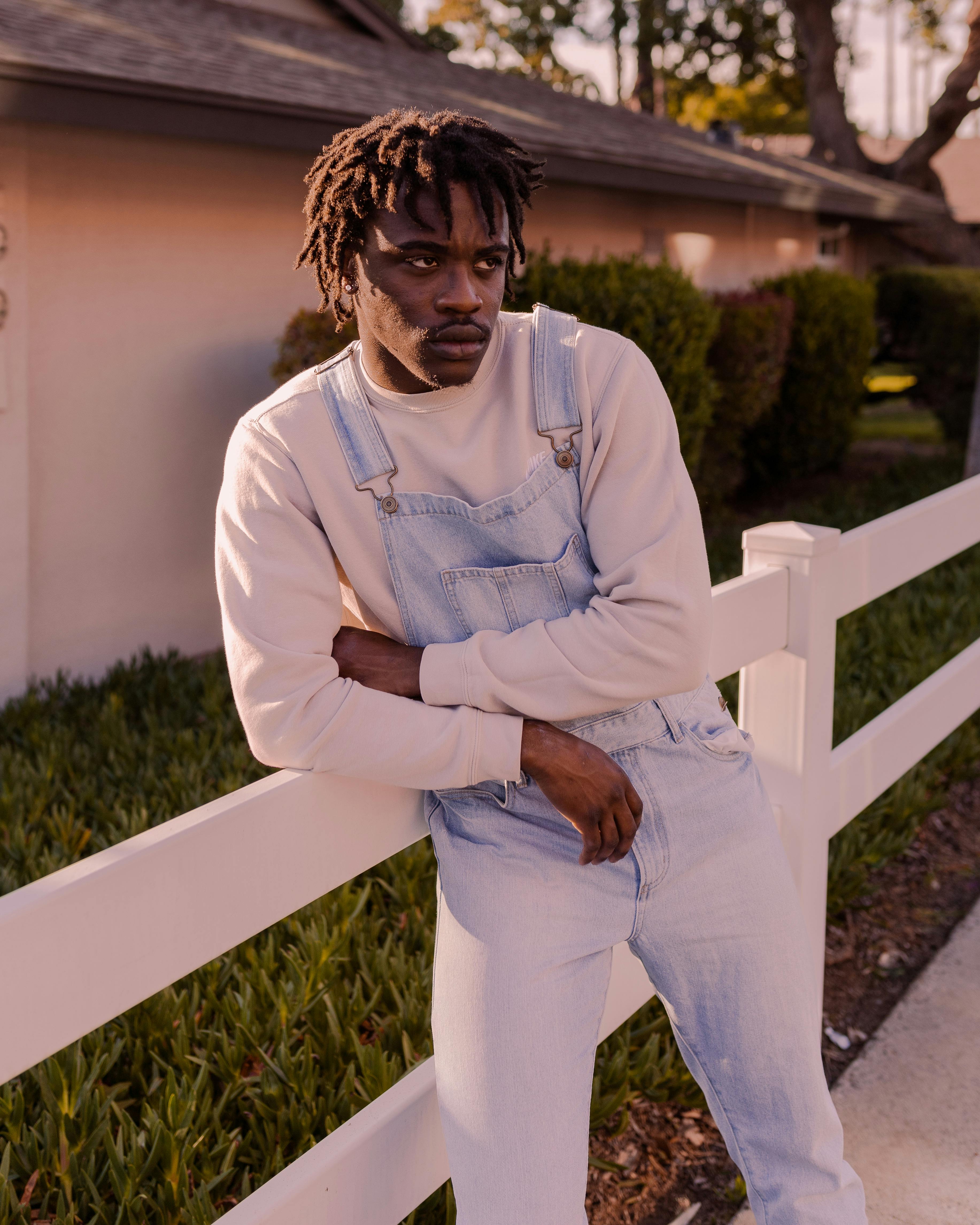 Man Posing by Railing · Free Stock Photo
