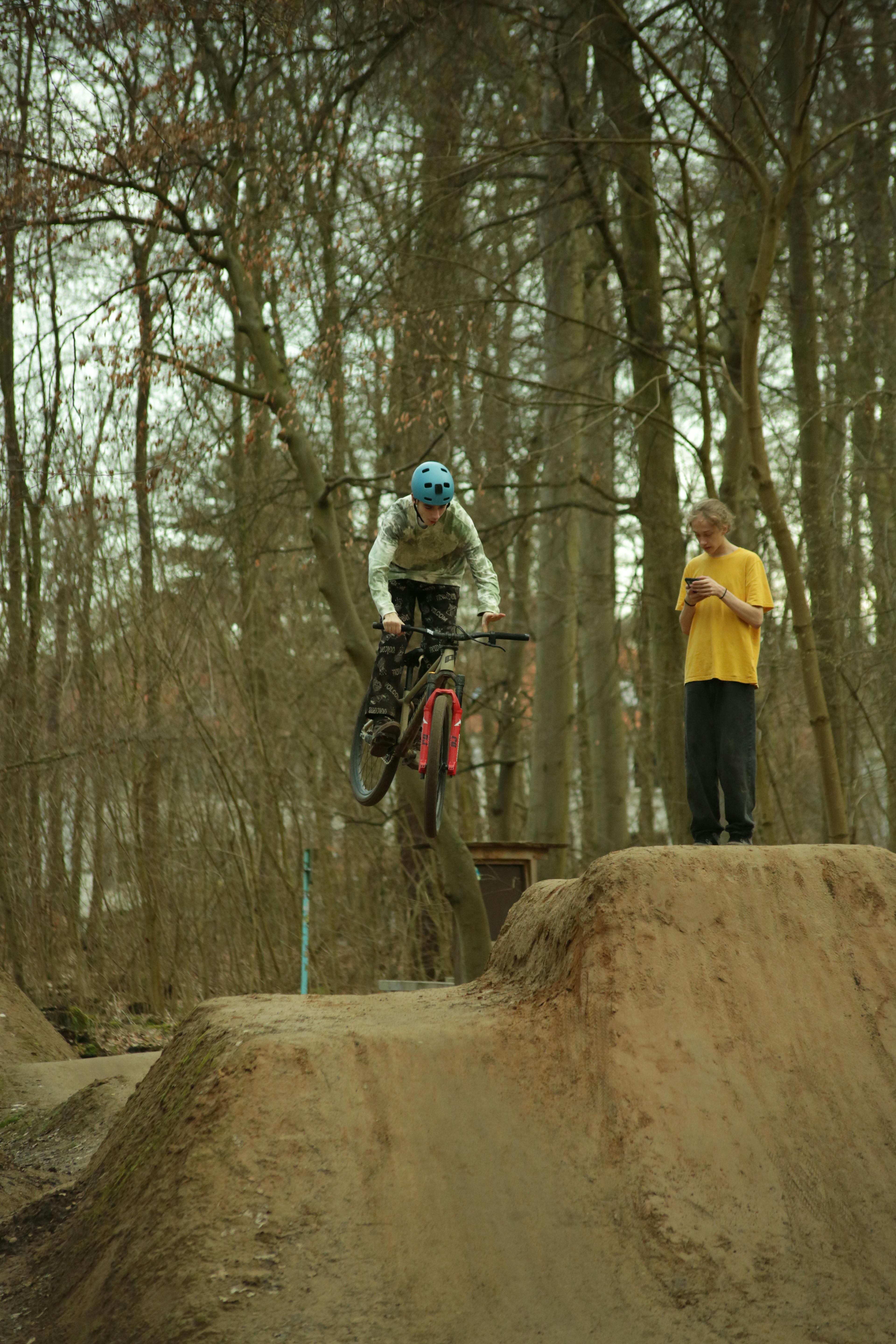 Man Doing Stunts on Bike at Sunset · Free Stock Photo