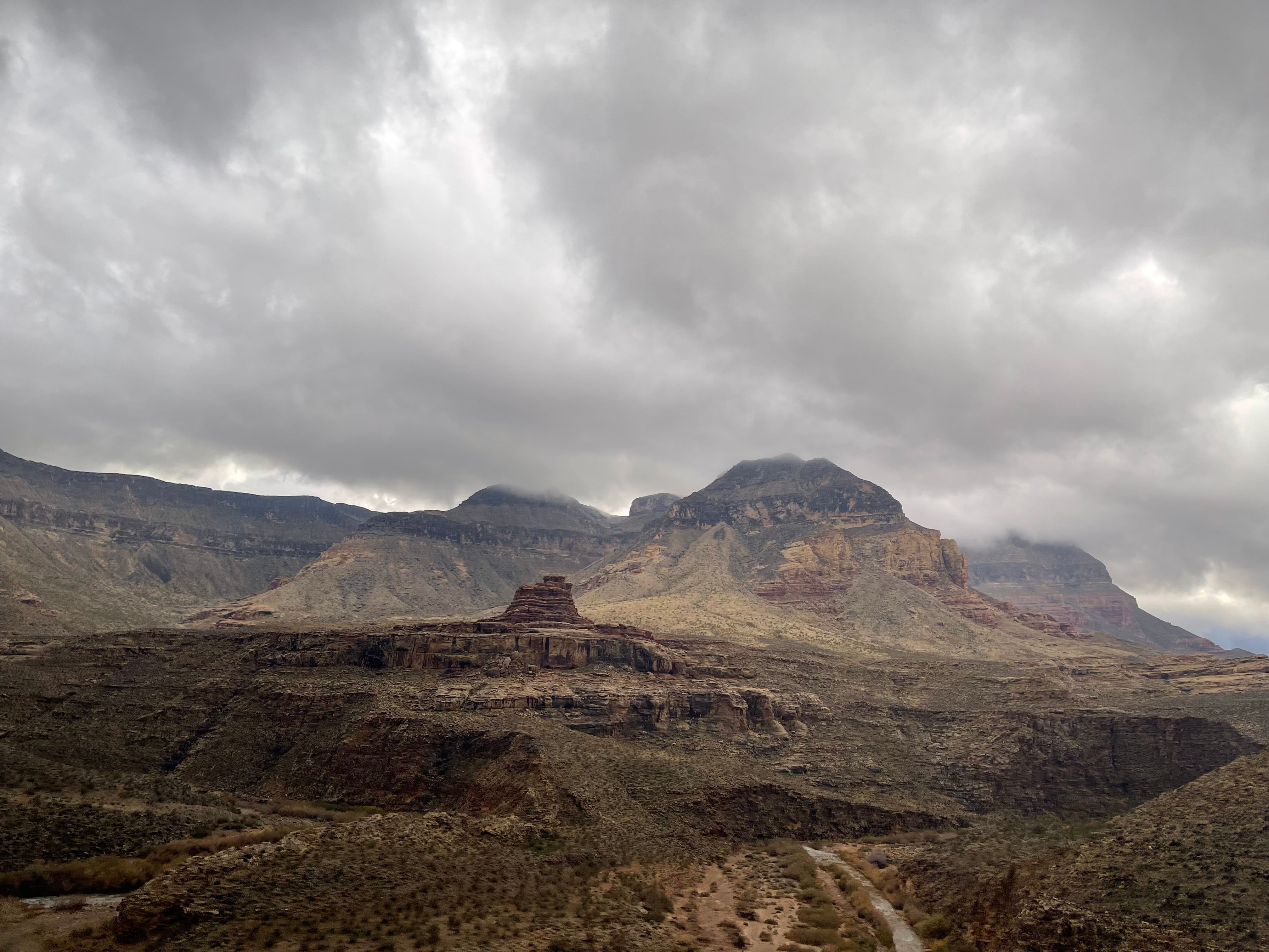 Overcast over Arid Hills · Free Stock Photo