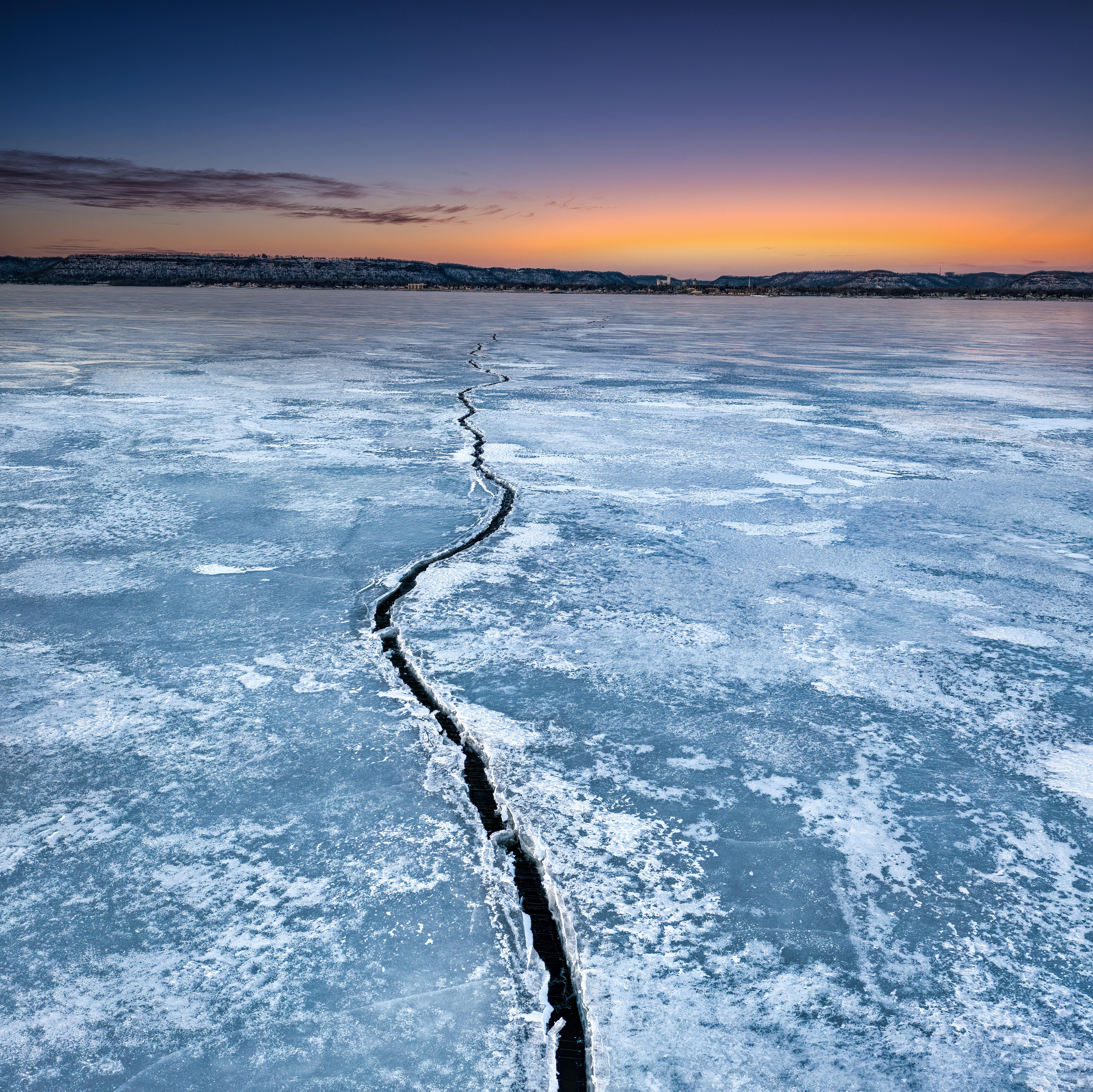 Crack on Ice Surface at Sunset · Free Stock Photo