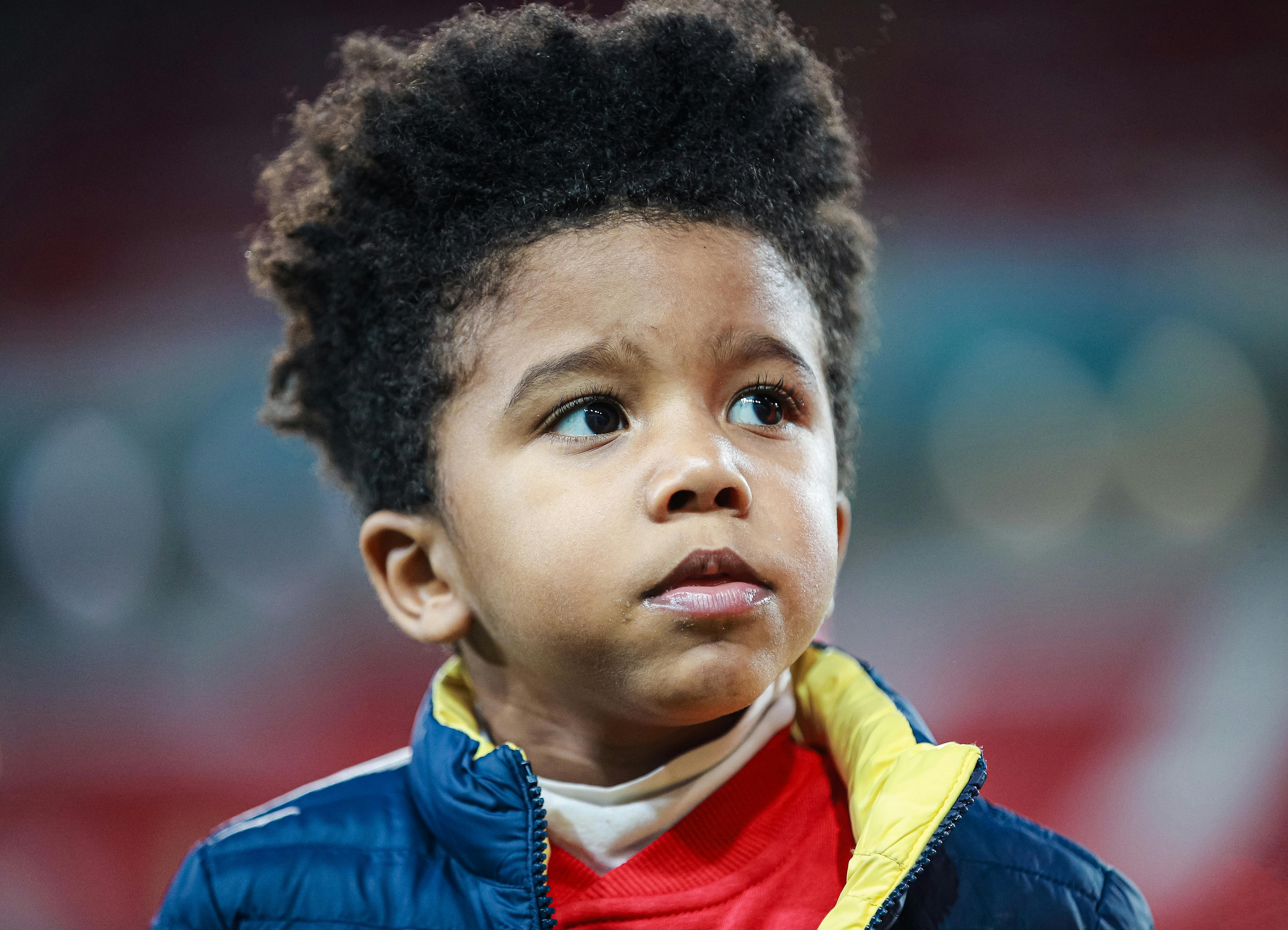 Portrait of Two Boys Lying on a Floor Head to Head · Free Stock Photo