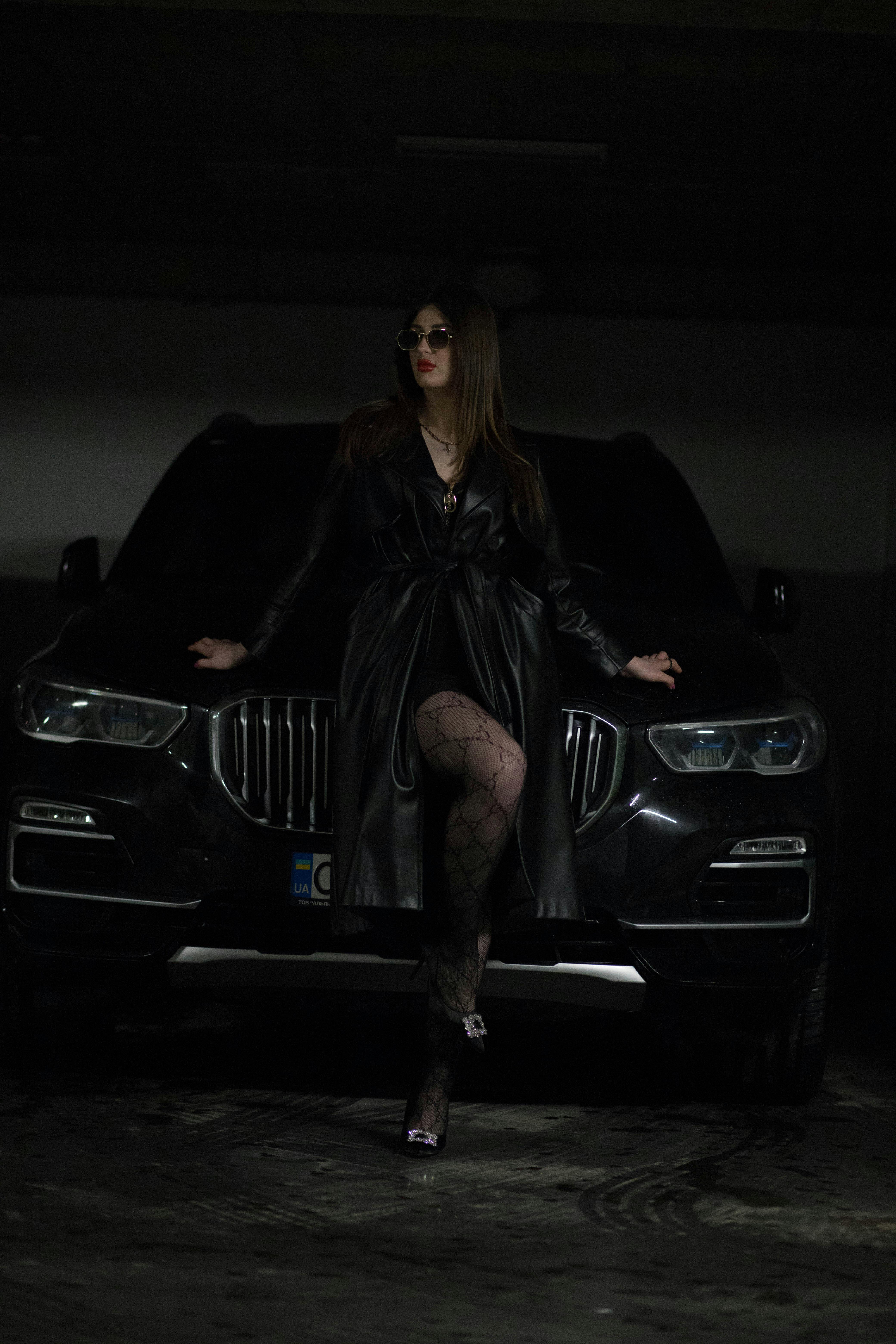 Model Squatting by BMW Car · Free Stock Photo