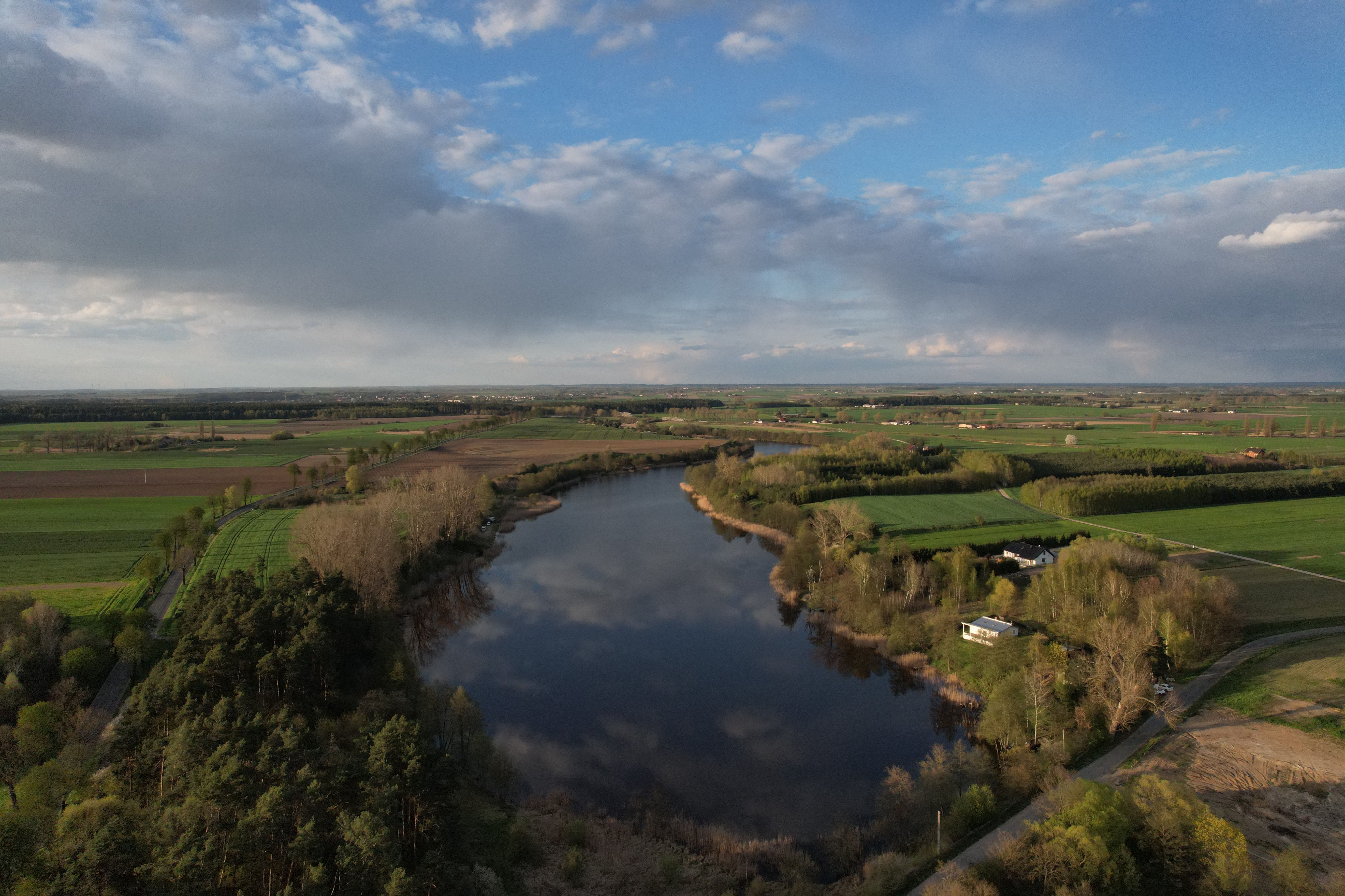 Aerial Photo of Fields and a Lake · Free Stock Photo