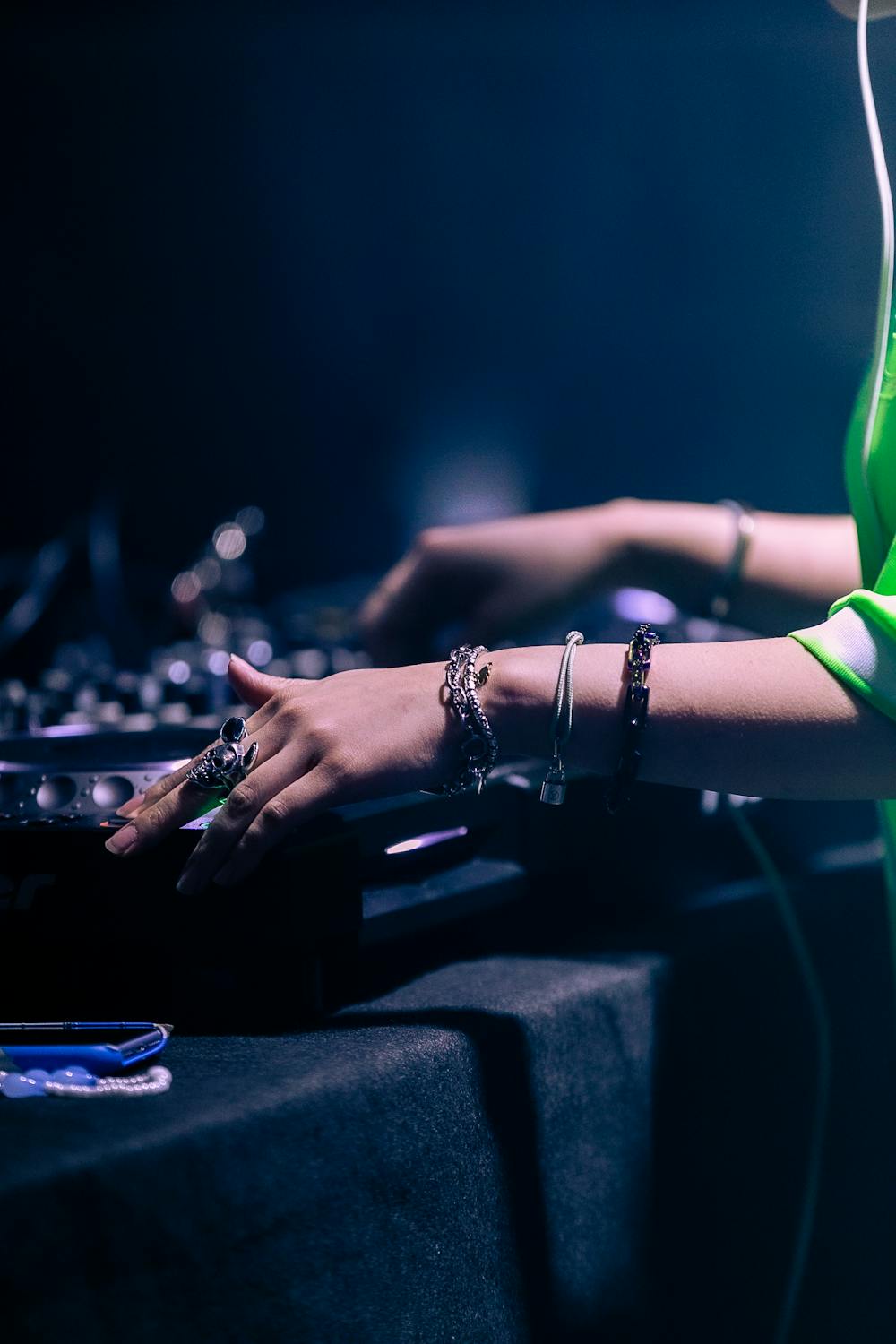 Close-up of a DJ Mixing Music on a DJ Controller · Free Stock Photo Close-up of a DJ Mixing Music on a DJ Controller · Free Stock Photo