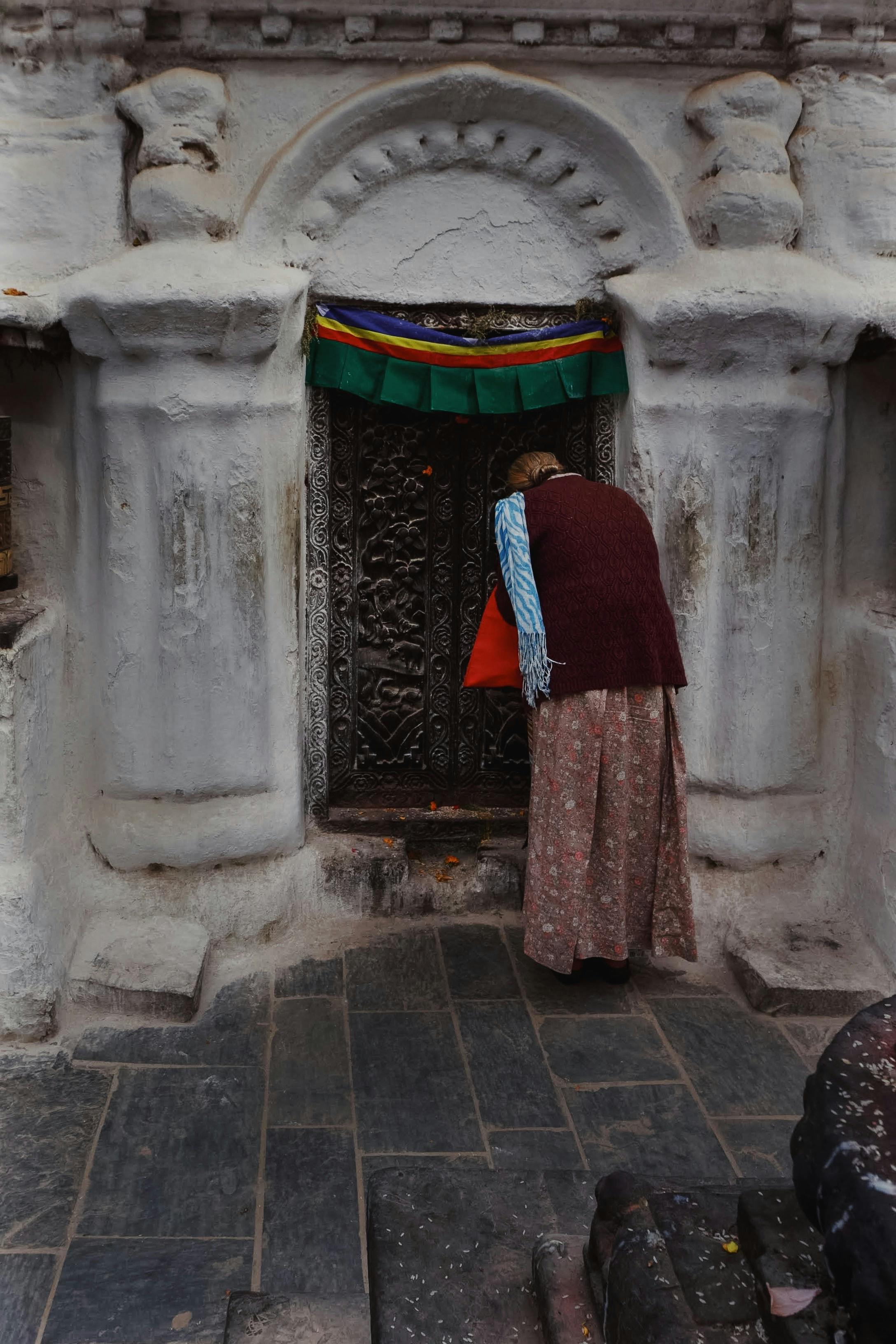 Prayer Standing in Front of Shrine · Free Stock Photo