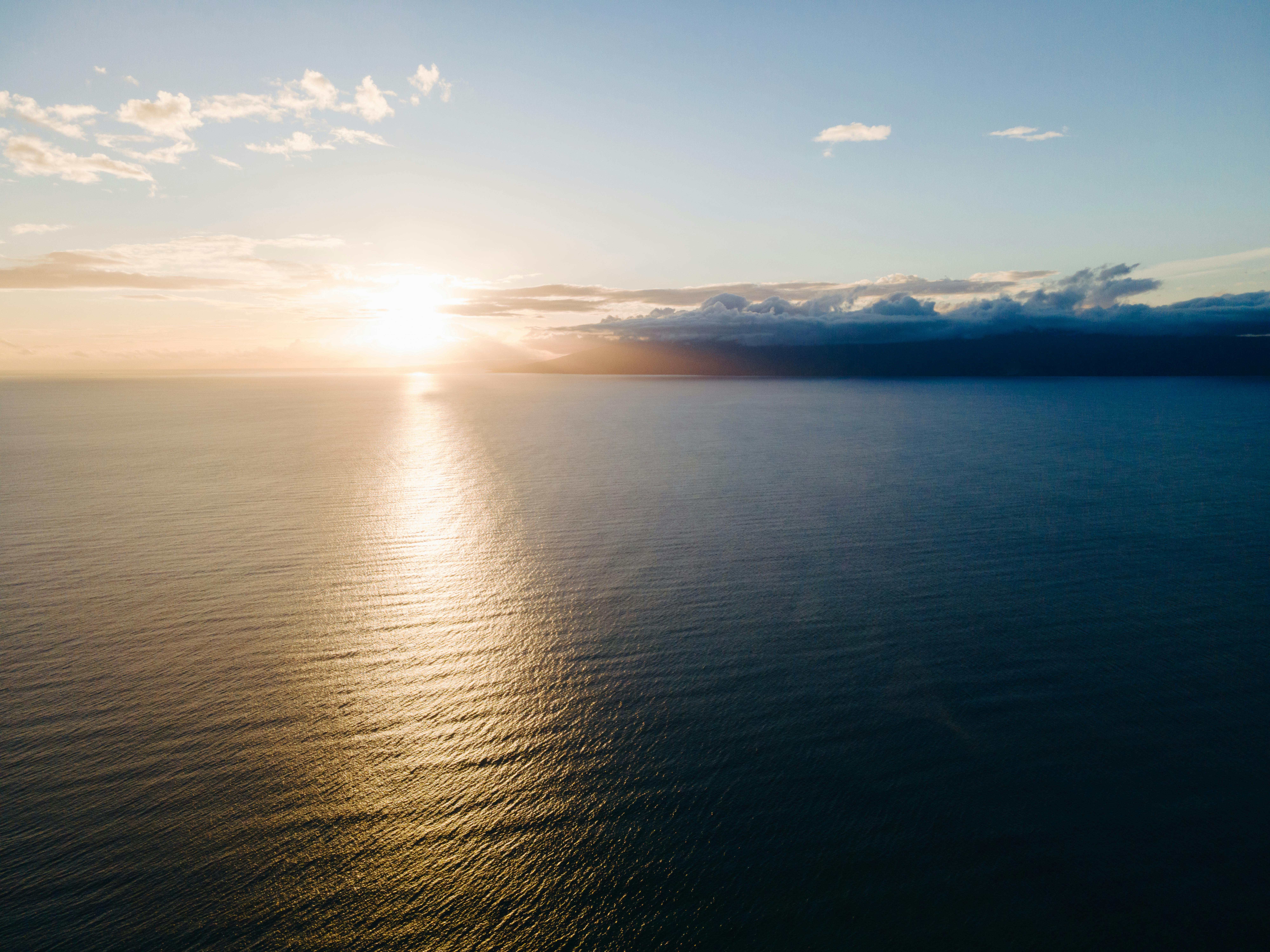 Sunlight over Open Sea at Sunset · Free Stock Photo