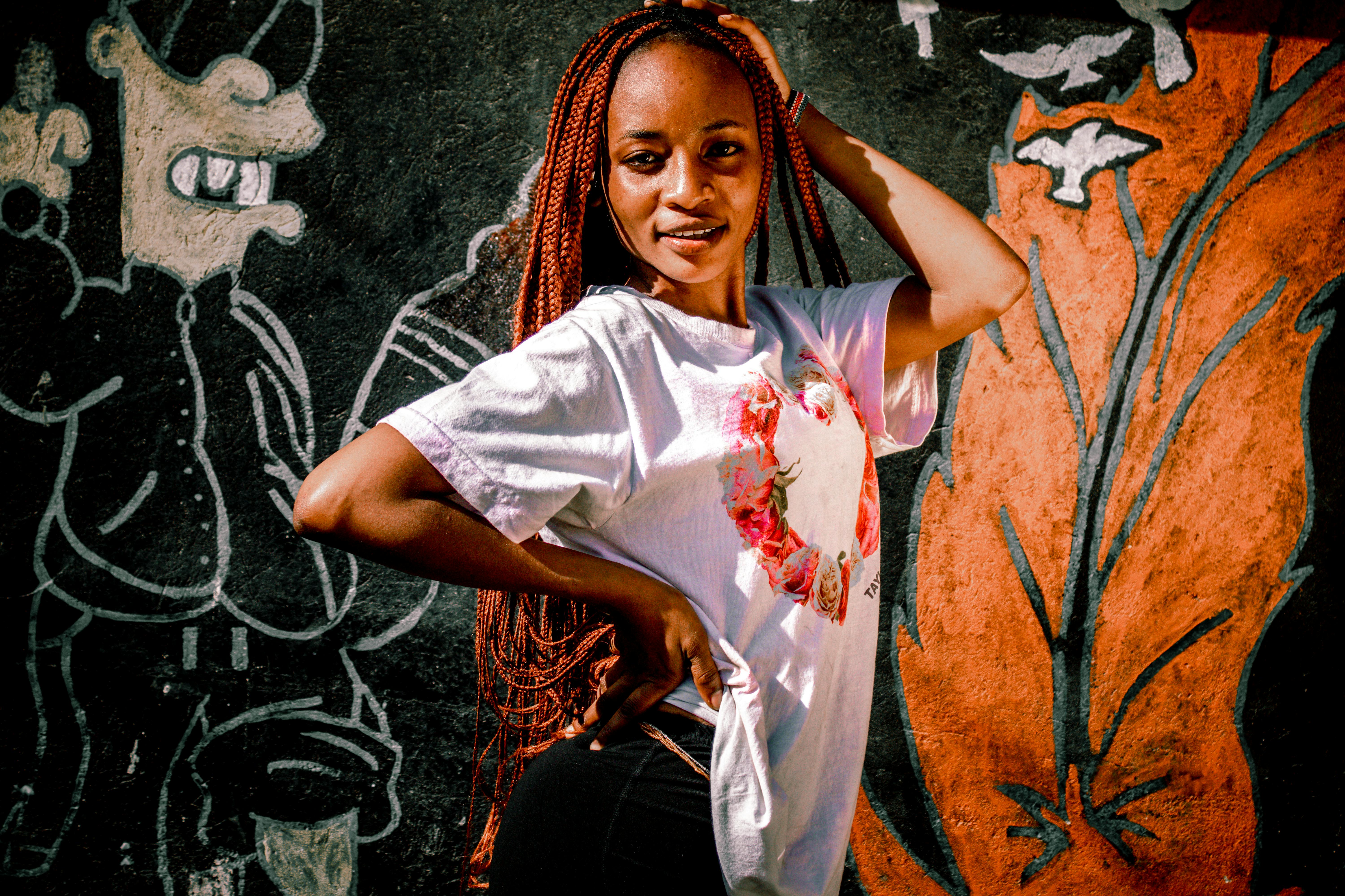 Woman Posing in Front of Graffiti on a Wall · Free Stock Photo