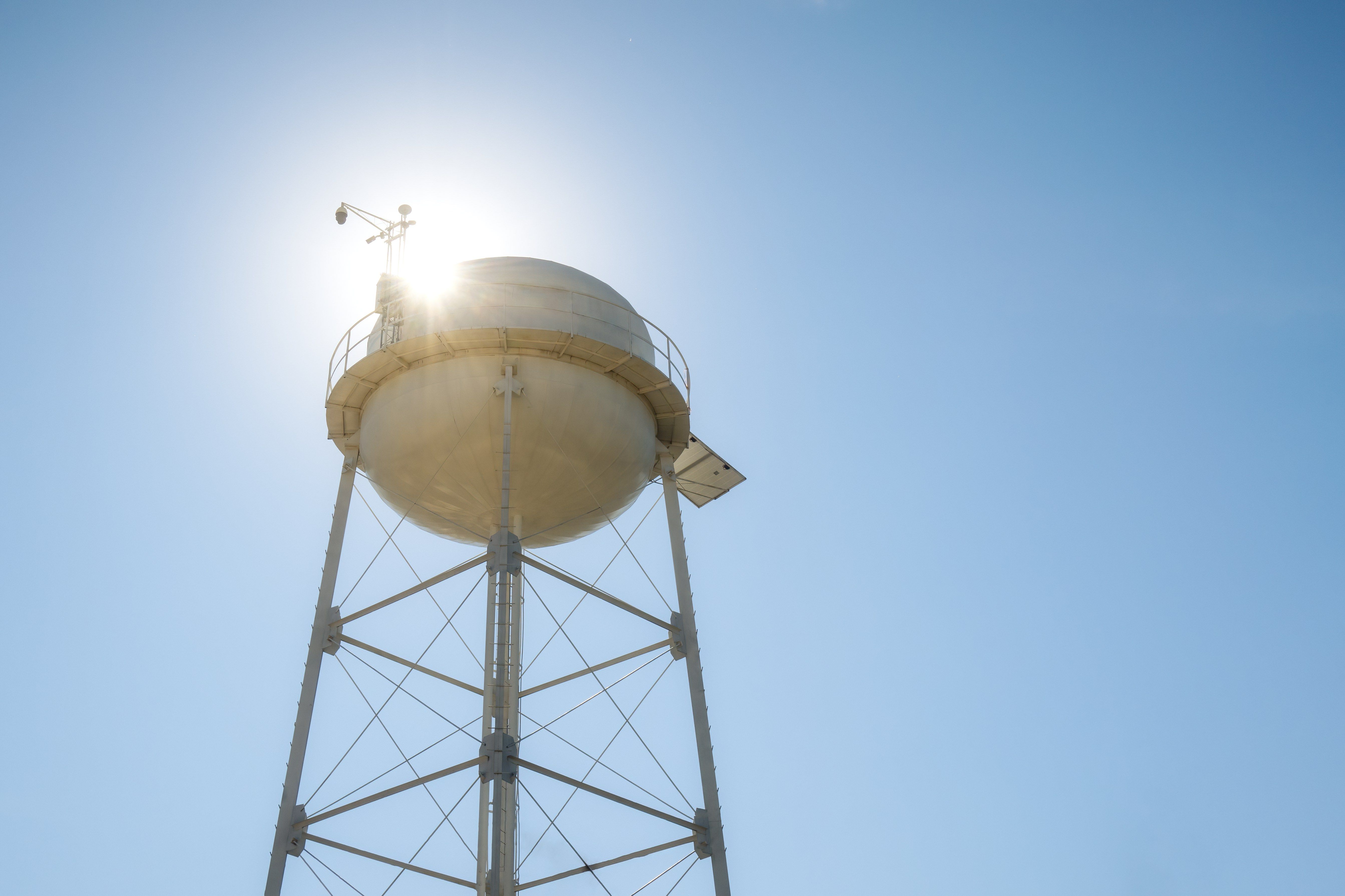 Man Model Climbing Watertower · Free Stock Photo