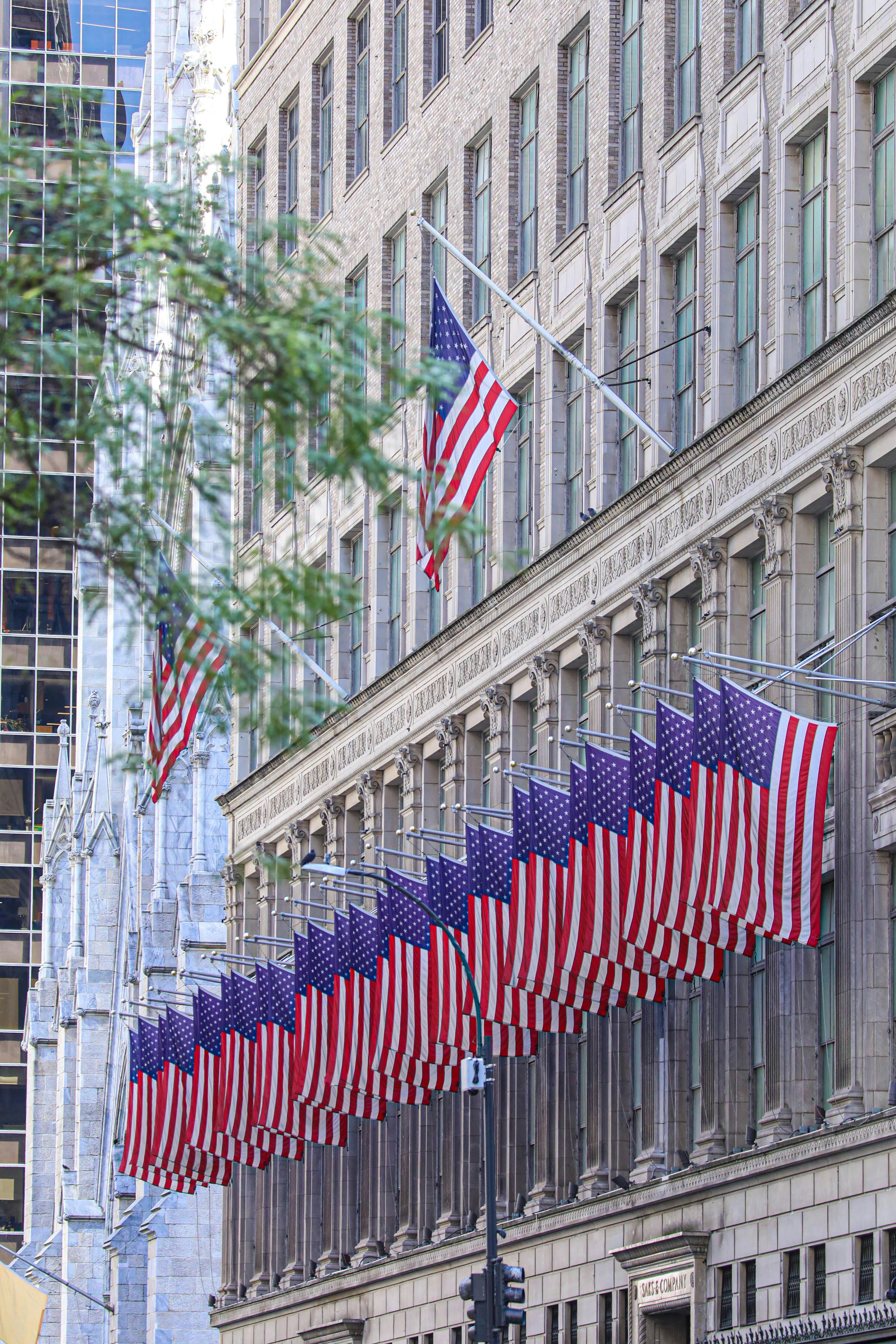 Colorful Flags in front of Building Facade · Free Stock Photo
