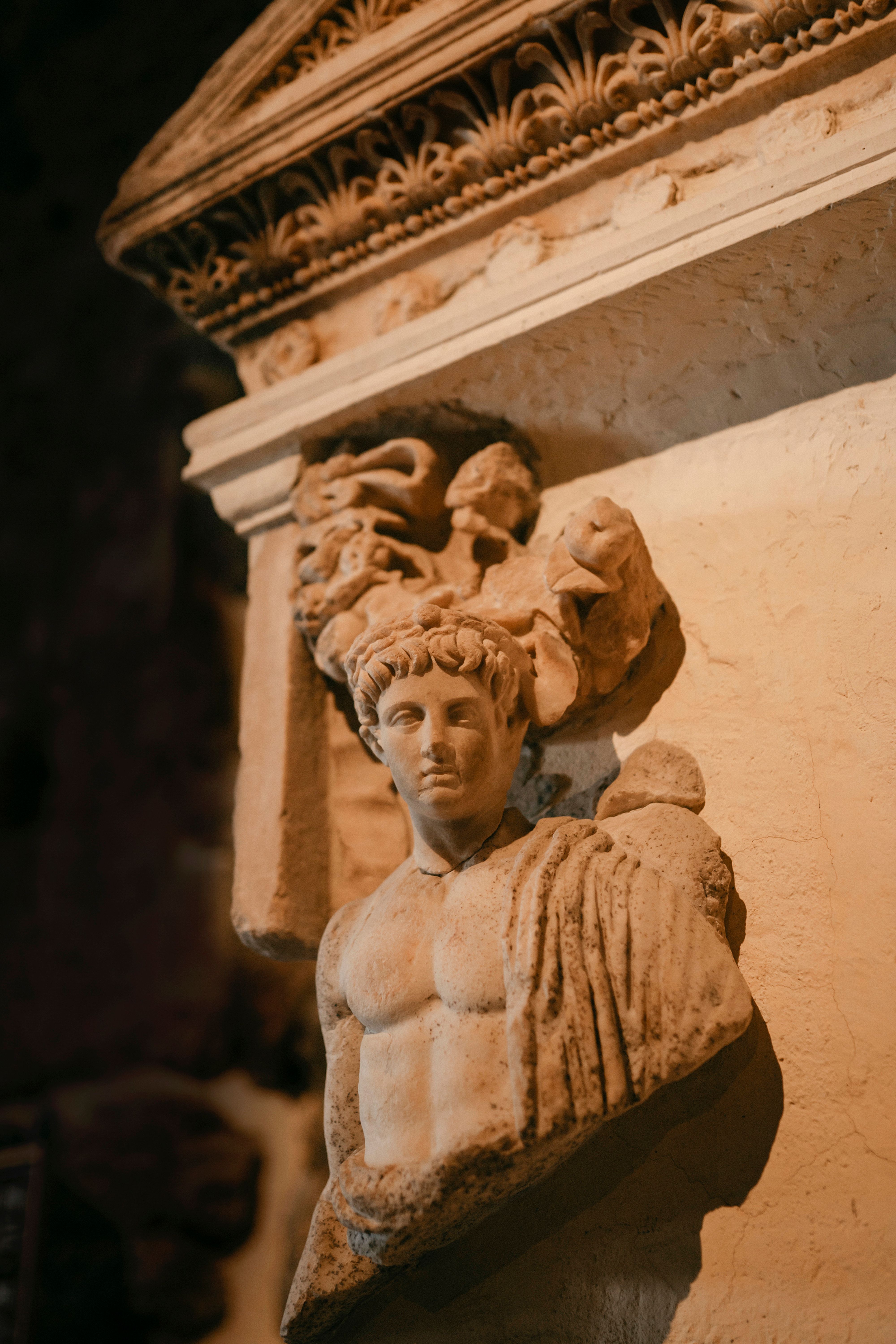 Sculpture on Building Wall · Free Stock Photo