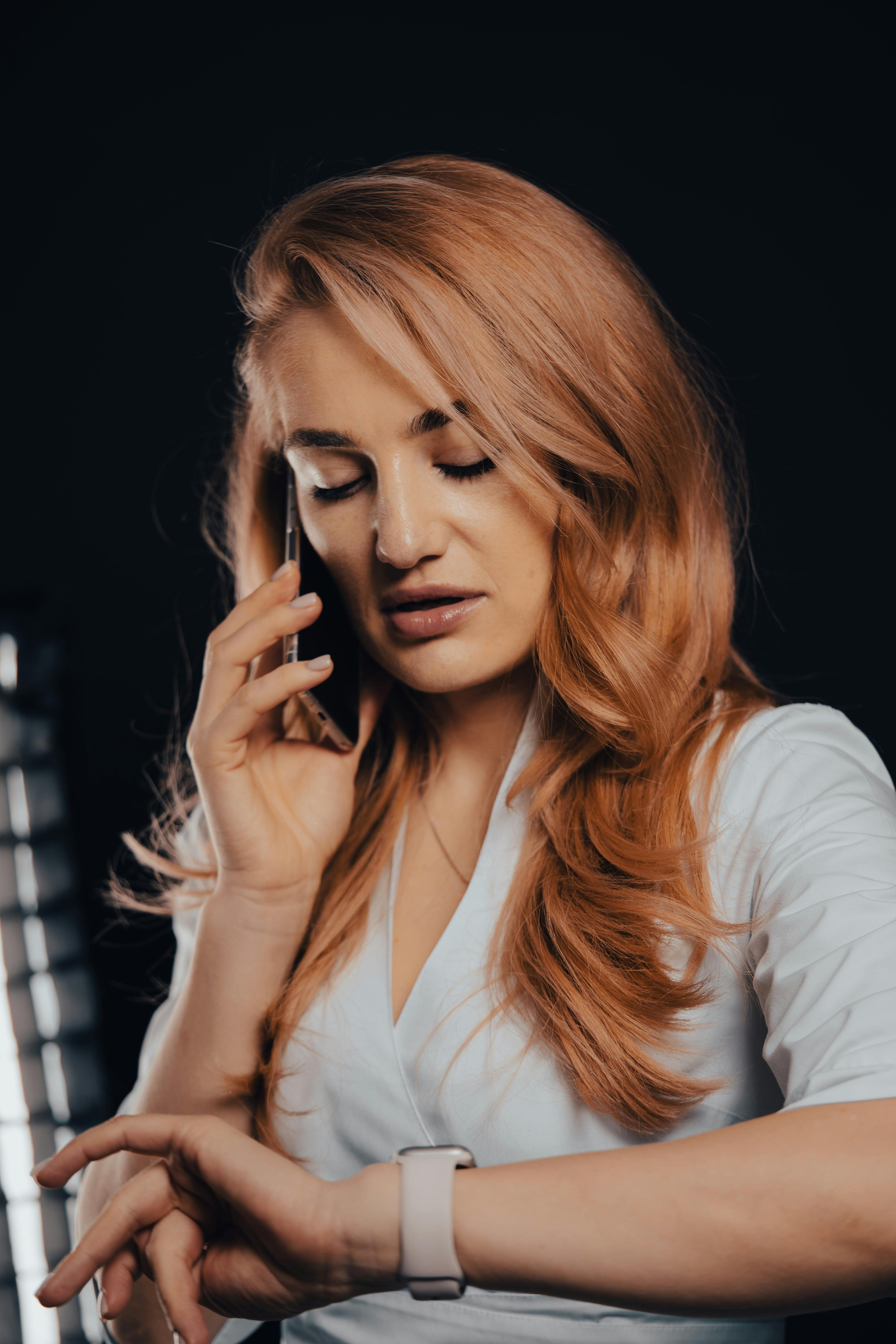 Portrait of a Woman Using a Phone · Free Stock Photo