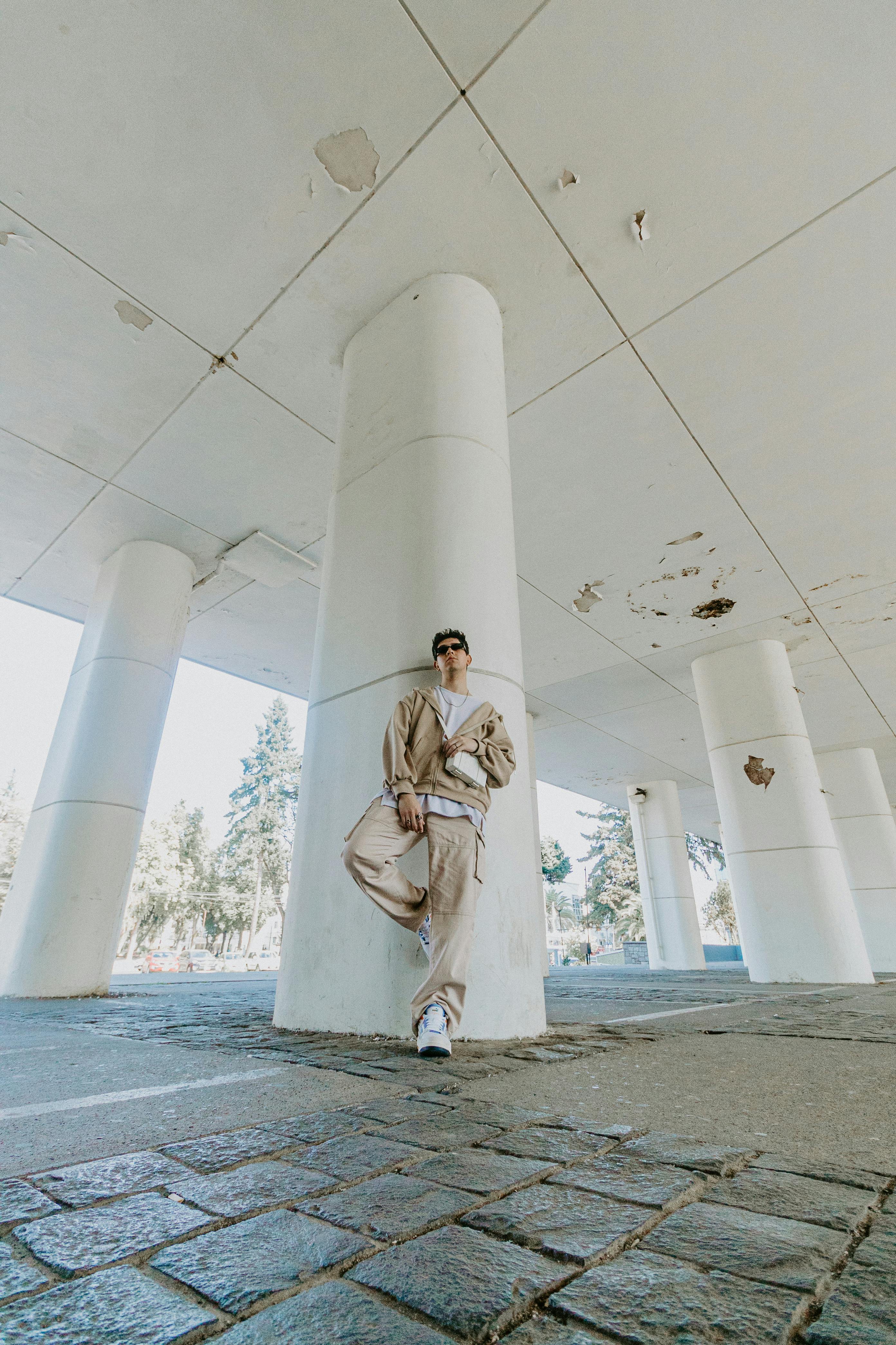 Man Posing in Sneaking Pose · Free Stock Photo