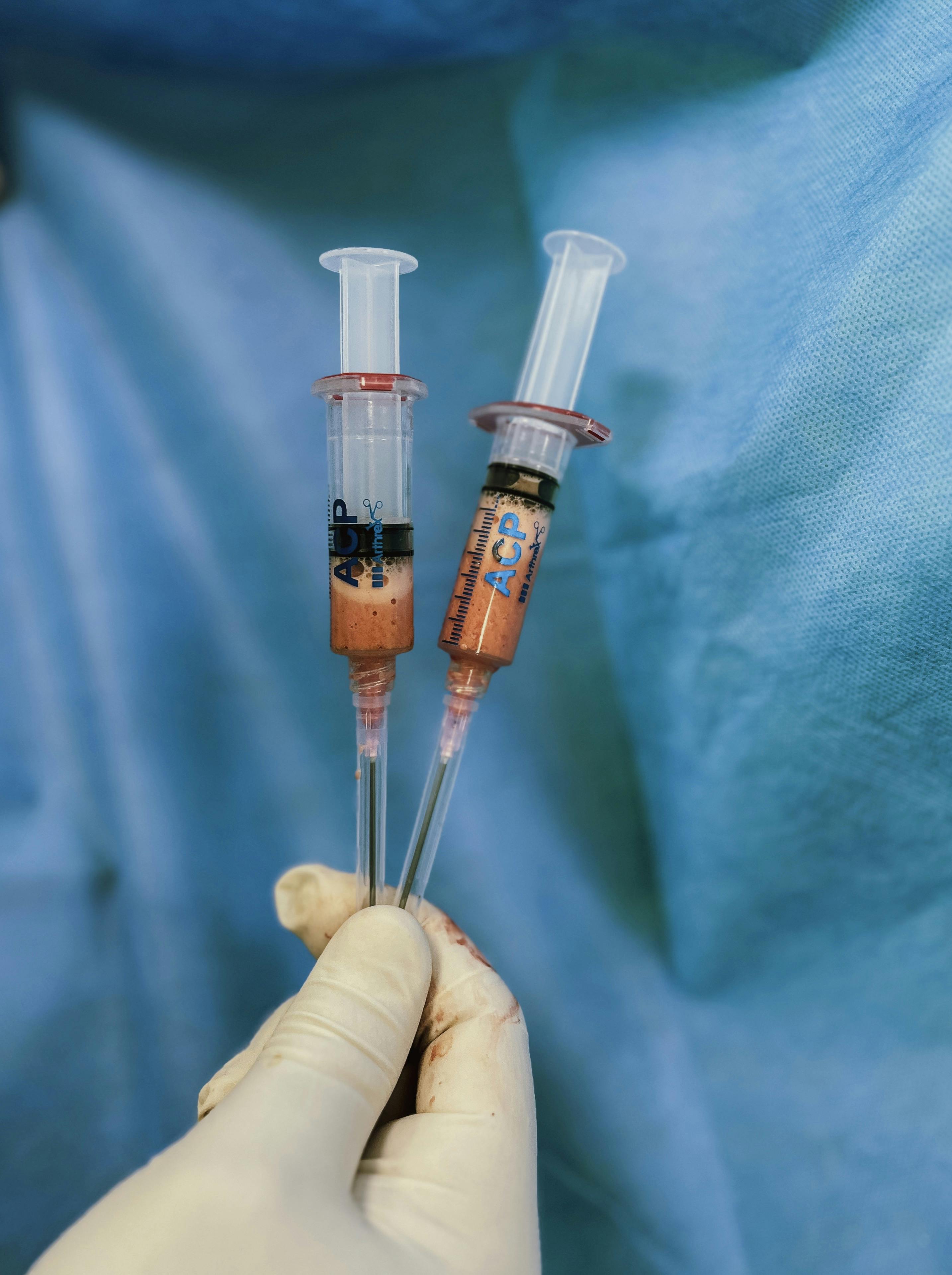 Person Holding Syringe · Free Stock Photo