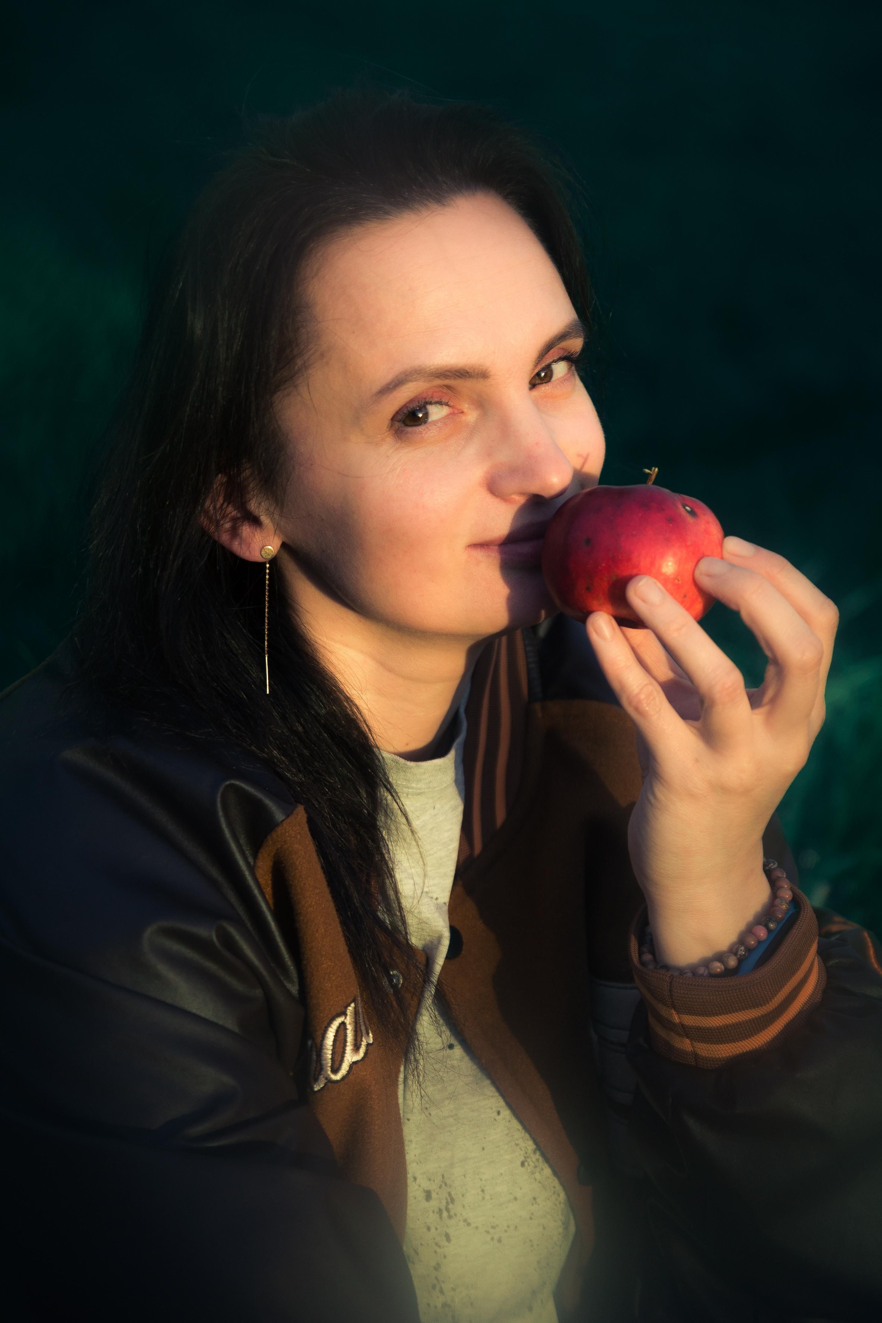 Brunette Woman Posing with Apple · Free Stock Photo