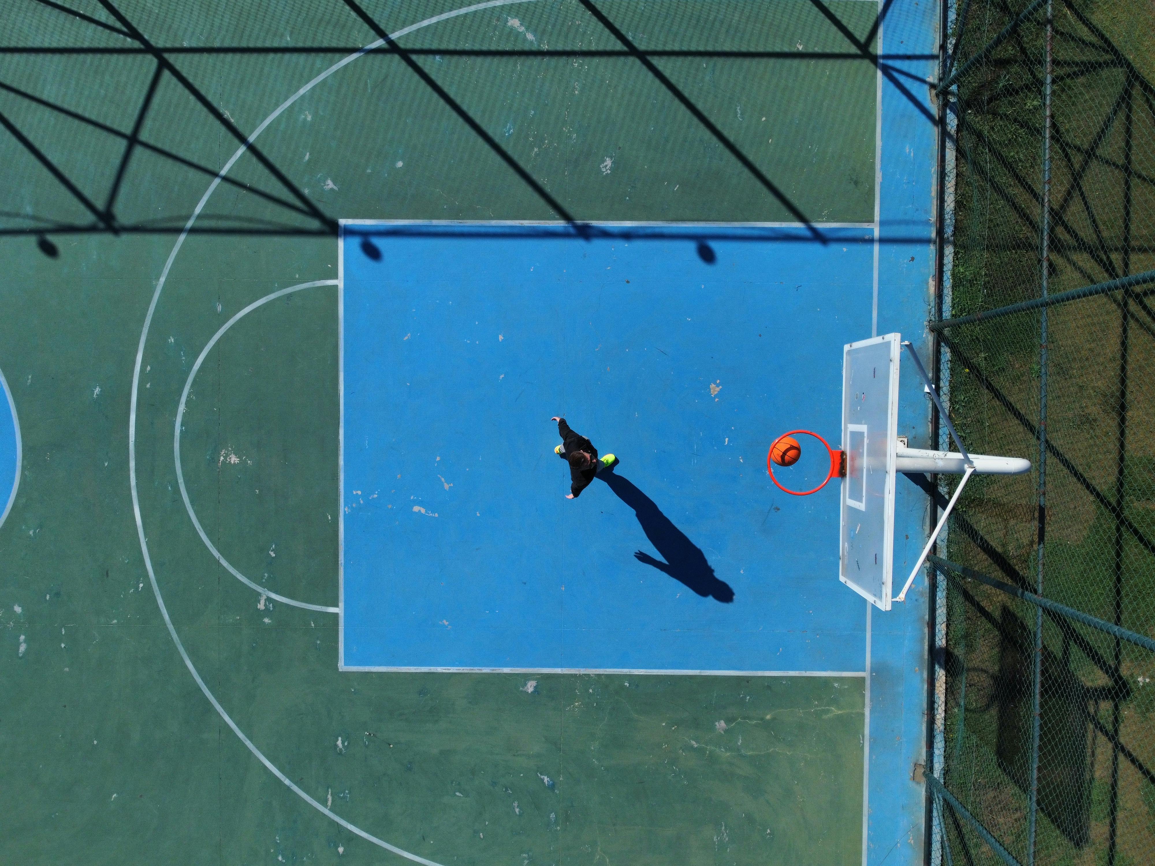 Ball on an Empty Basketball Court · Free Stock Photo
