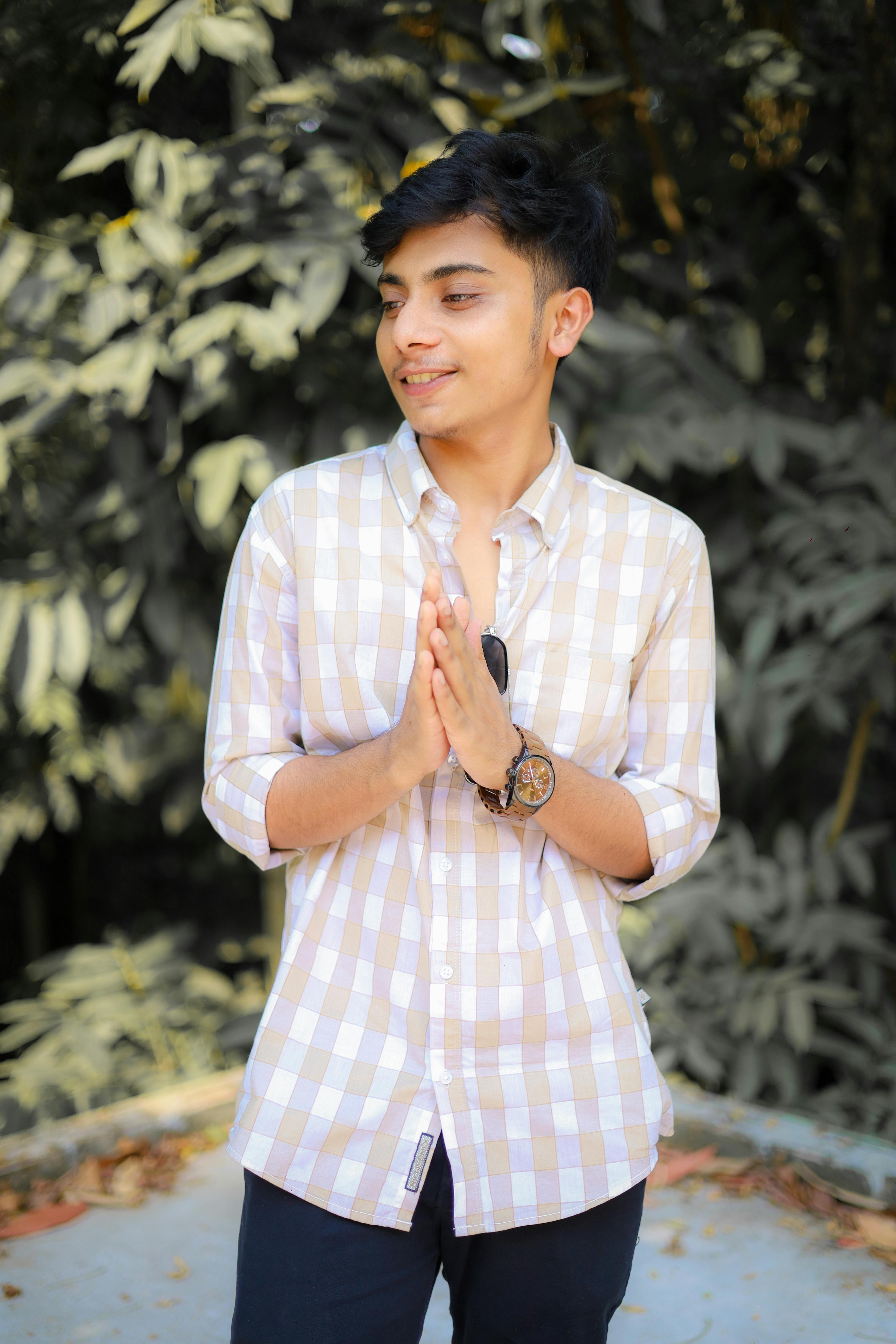 Short Haired Man in Blue Checked Suit Posing in a Park · Free Stock Photo