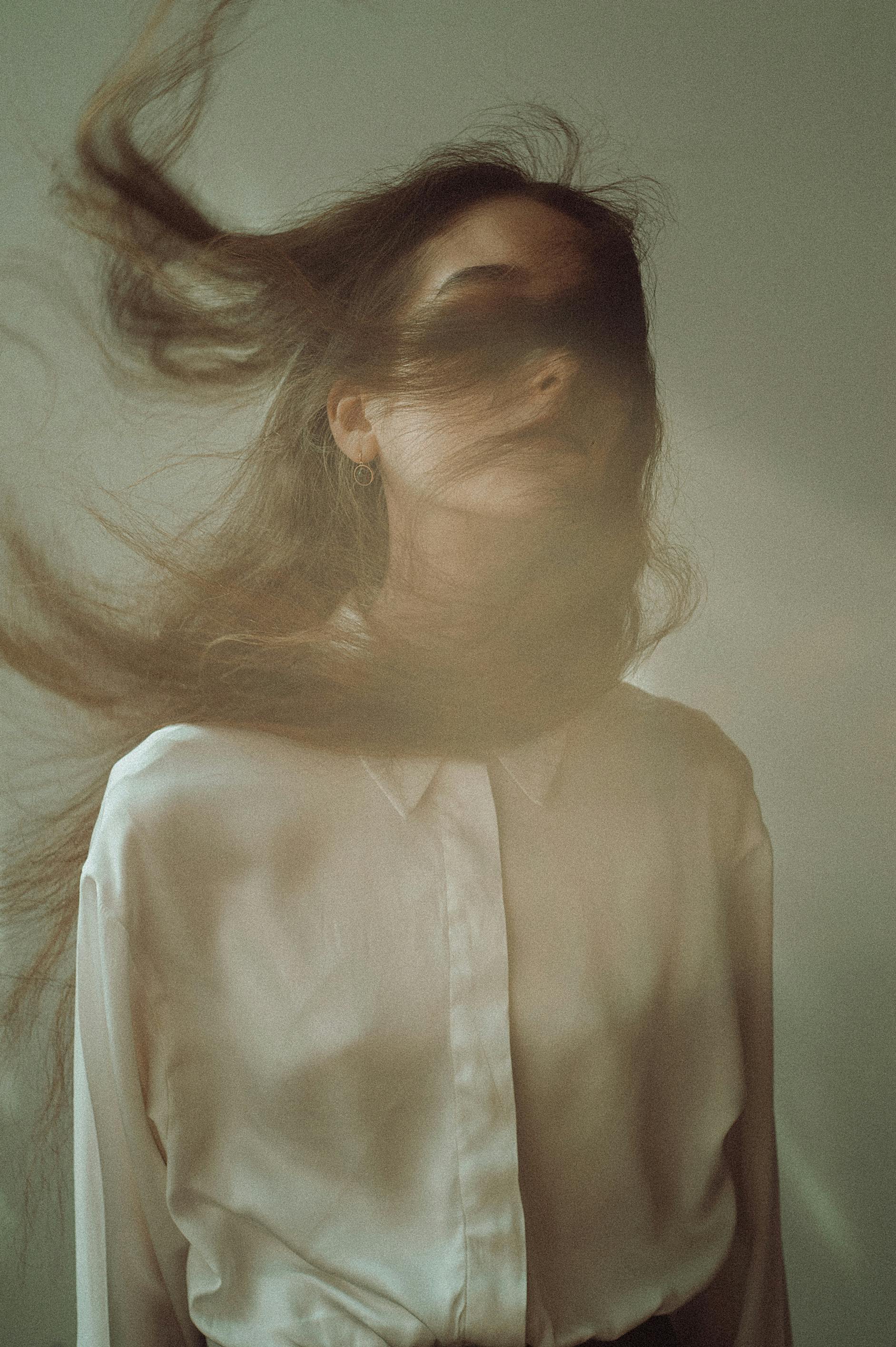 Woman Posing with Hair over Face · Free Stock Photo