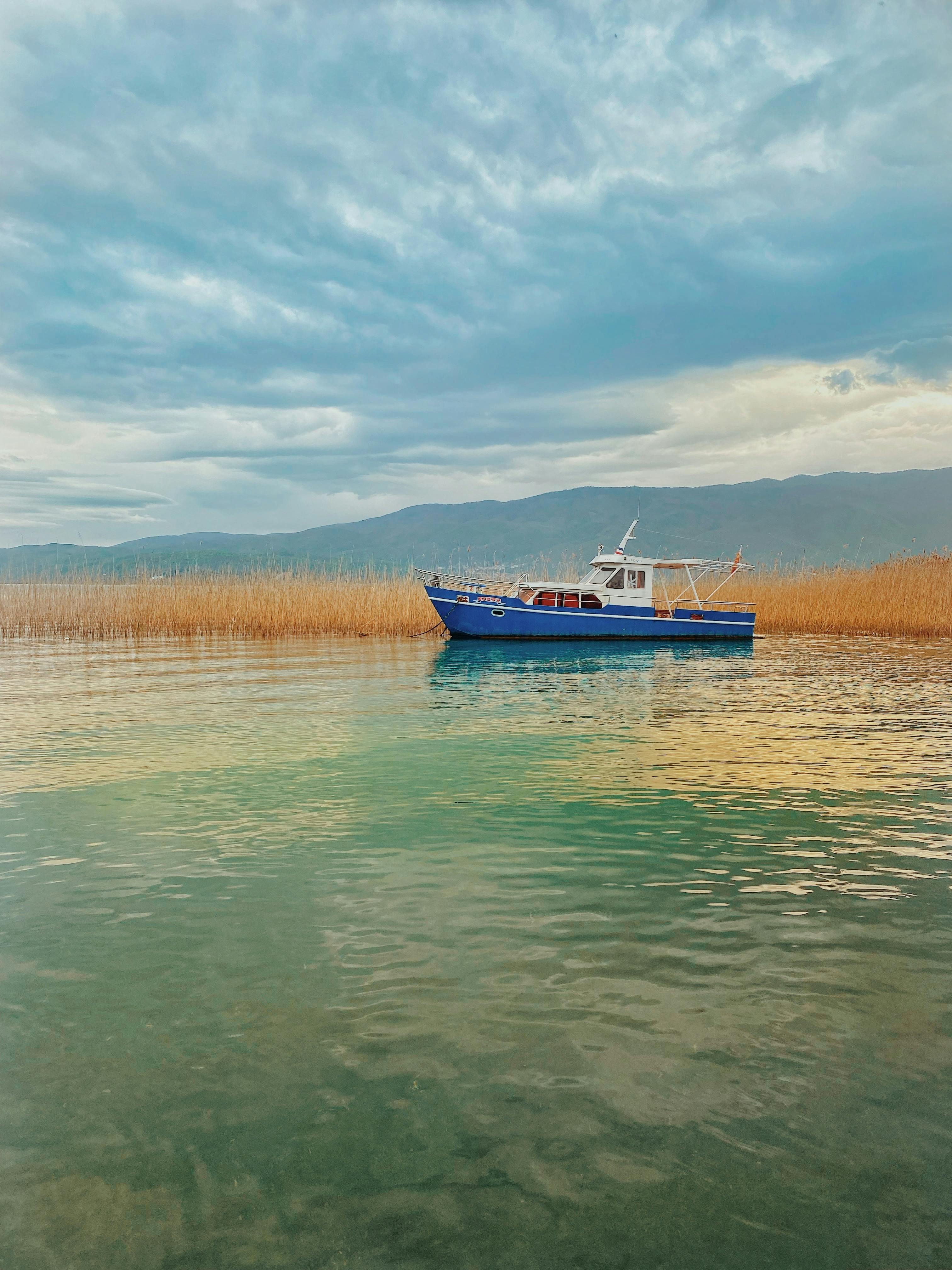 A Boat Swimming on the Sea · Free Stock Photo
