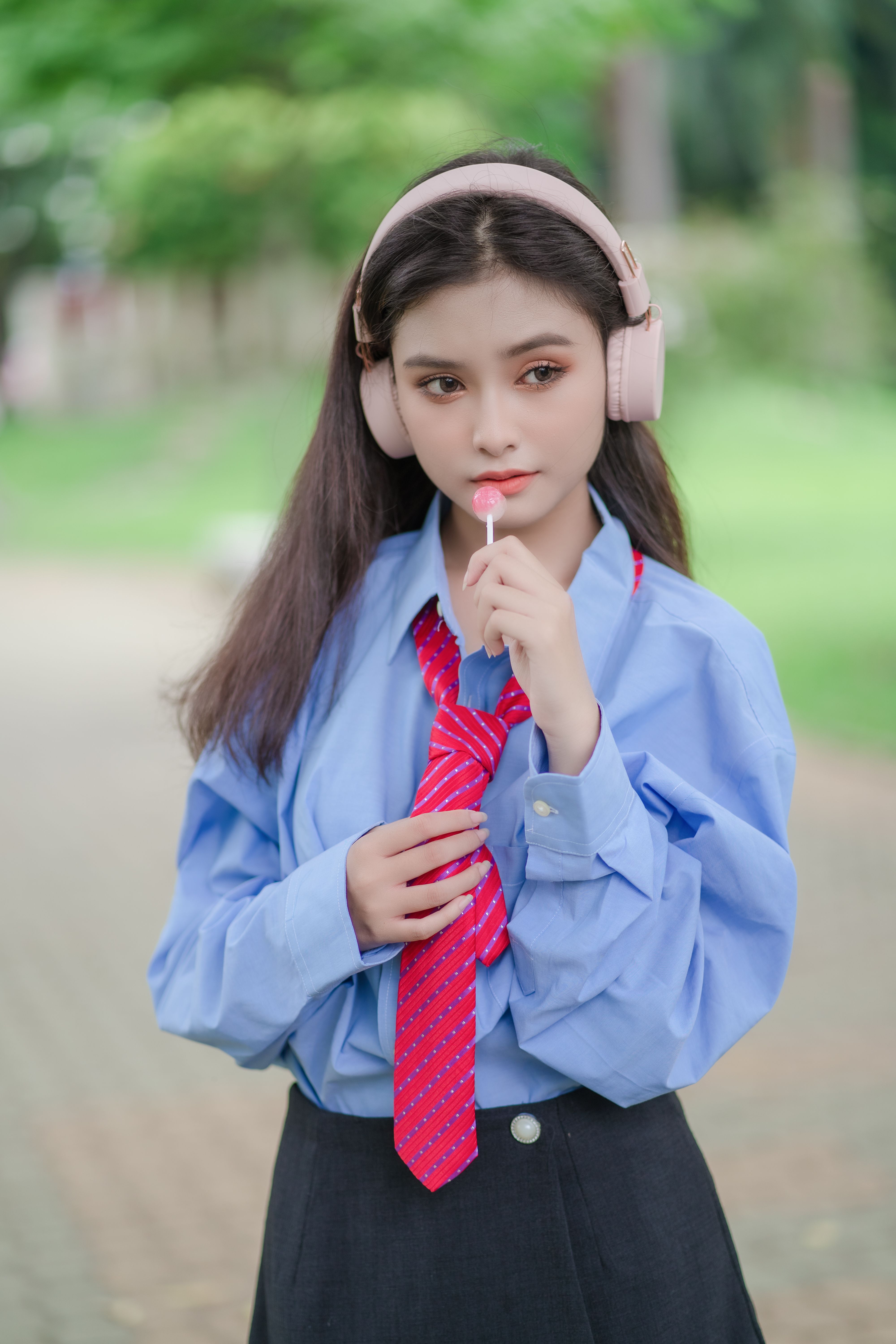 Portrait of Woman in Blue Shirt with Tie · Free Stock Photo