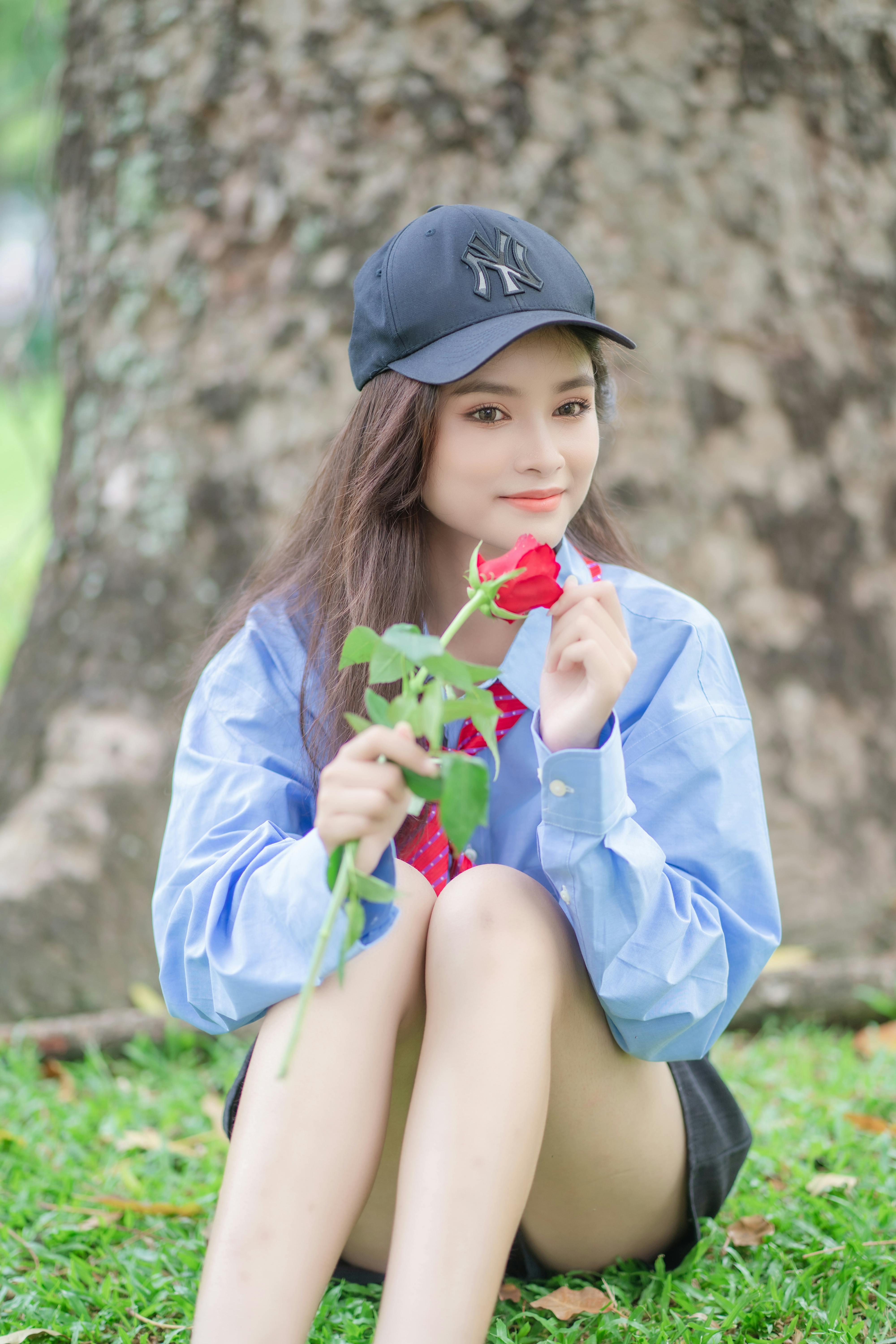 Sitting Woman in Cap · Free Stock Photo