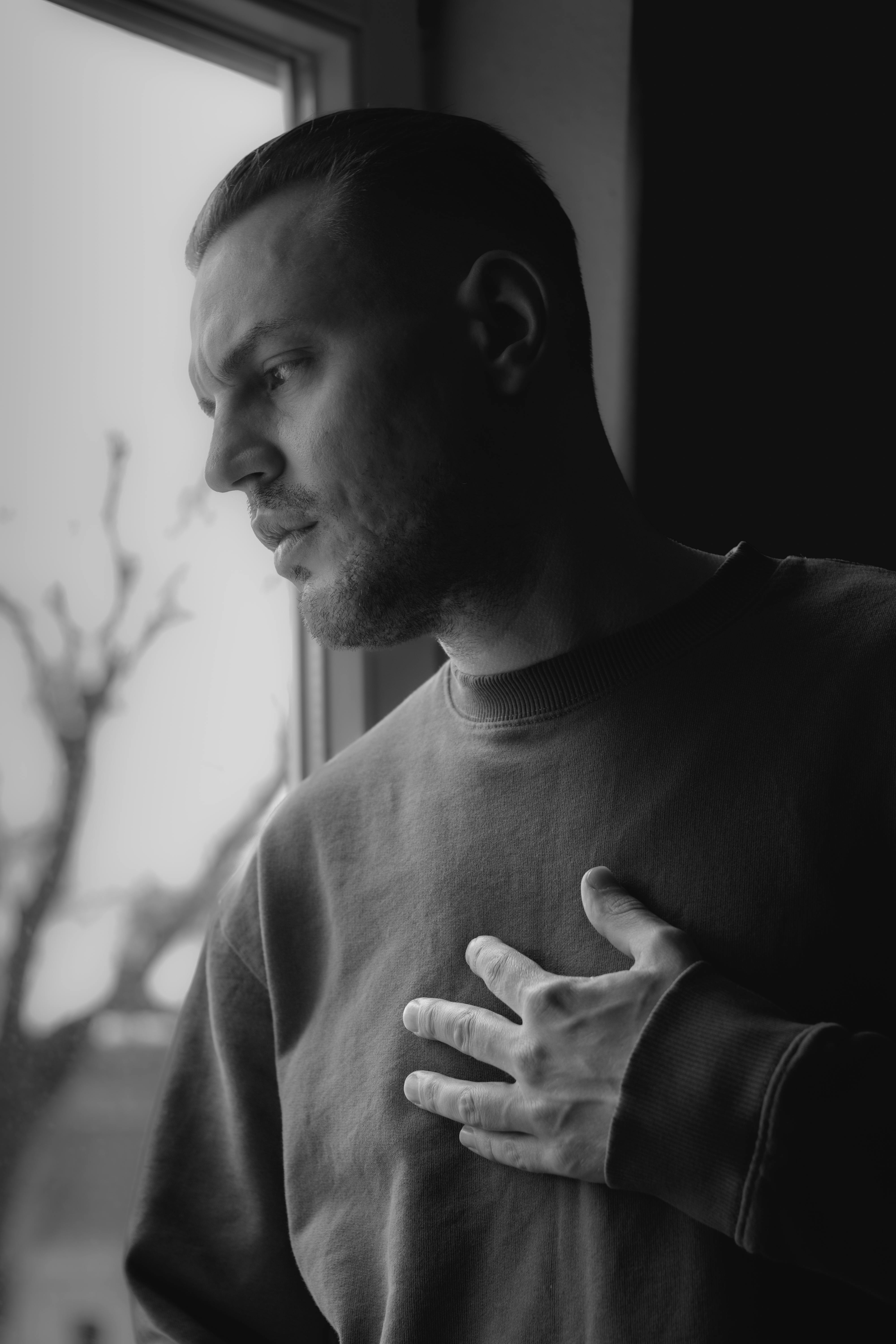 Two People Standing behind the Glass · Free Stock Photo