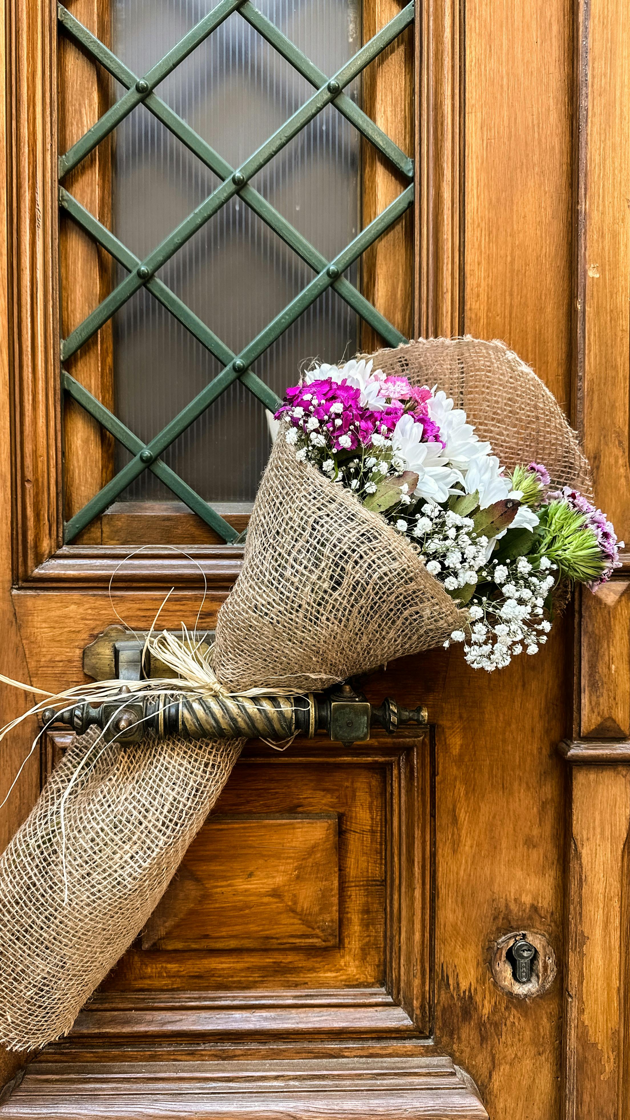 Flowers on Wooden Door · Free Stock Photo