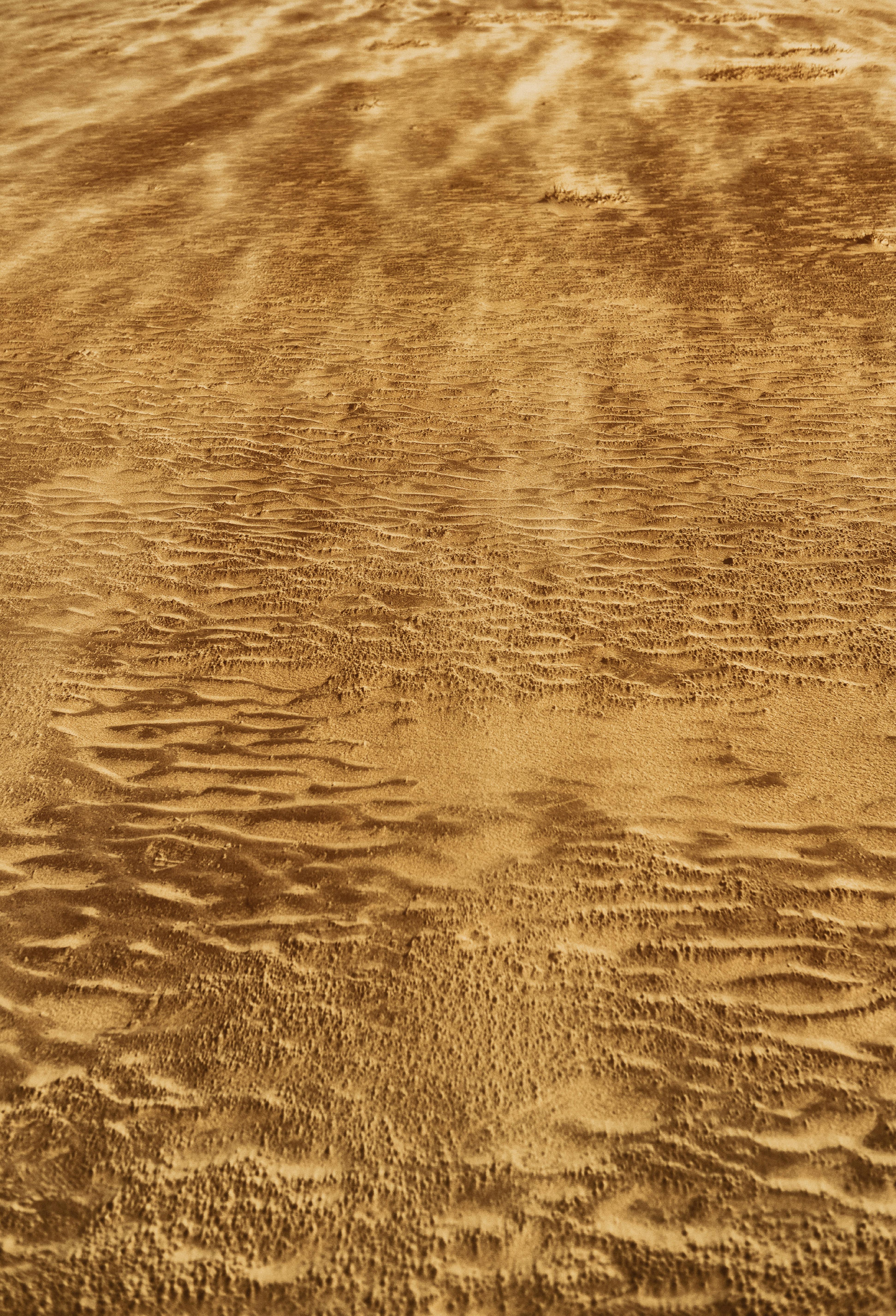 Textured sandy surface in desert · Free Stock Photo