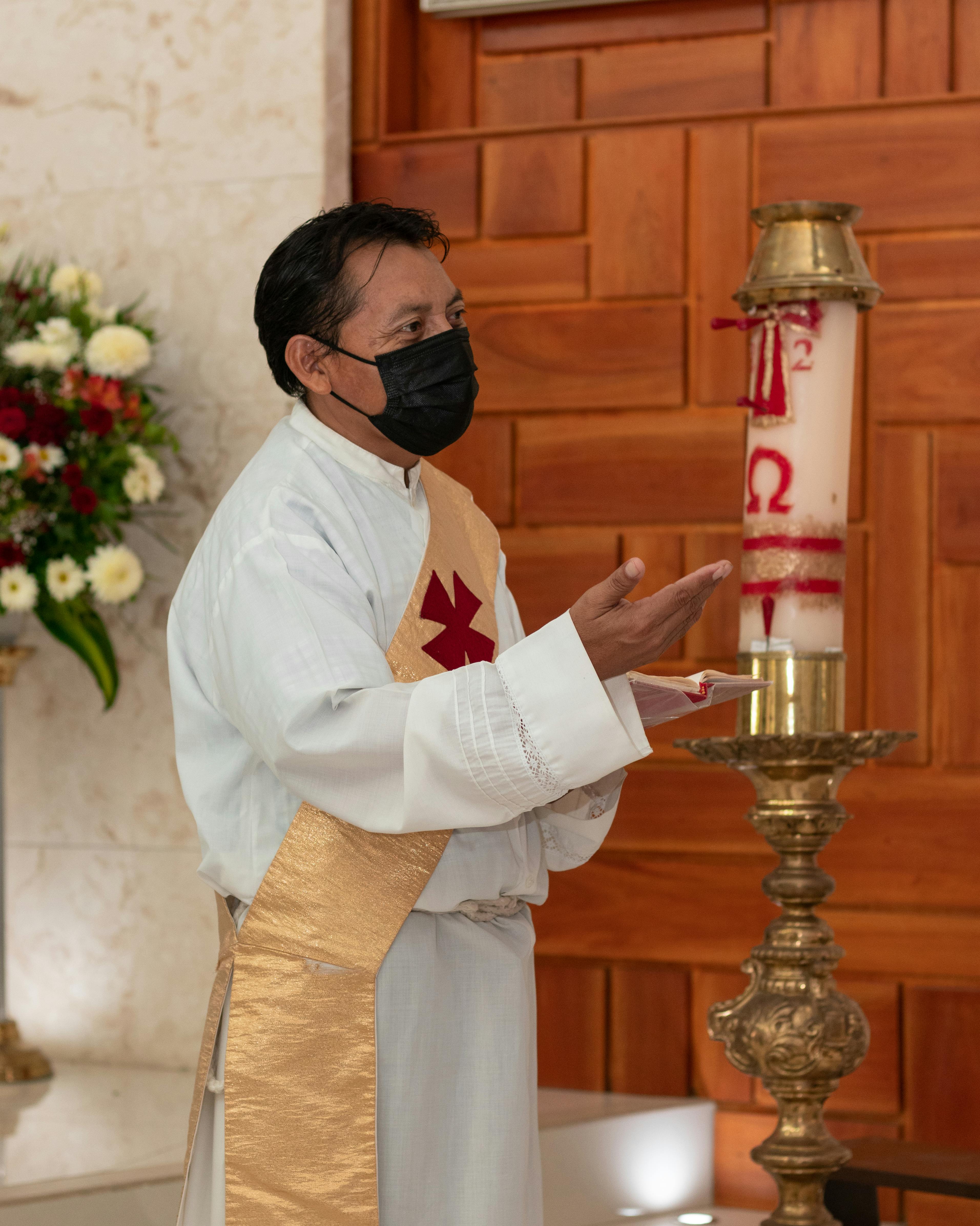 Catholic Priest Praying in a Church · Free Stock Photo