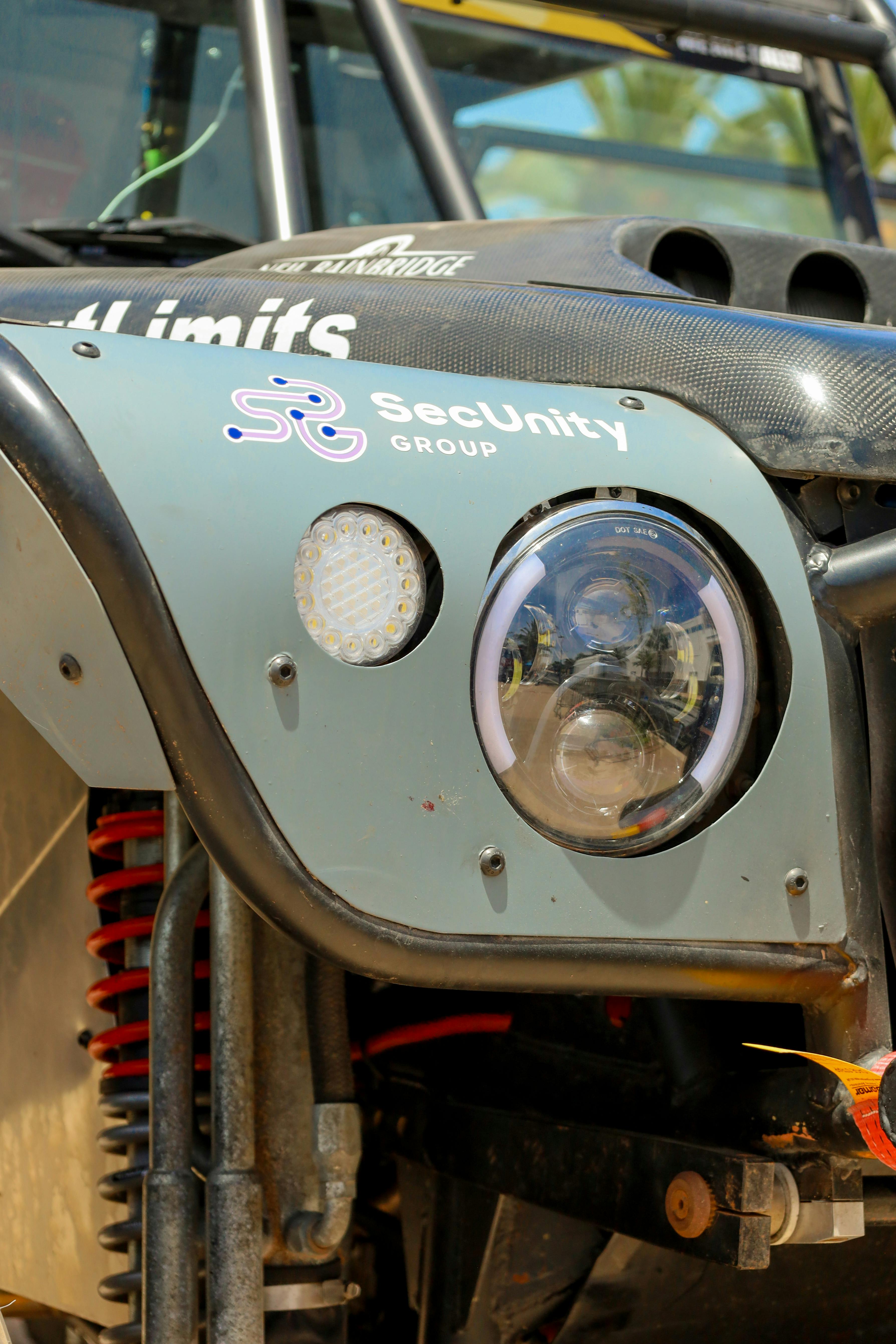 Headlight of Silver Rally Car · Free Stock Photo