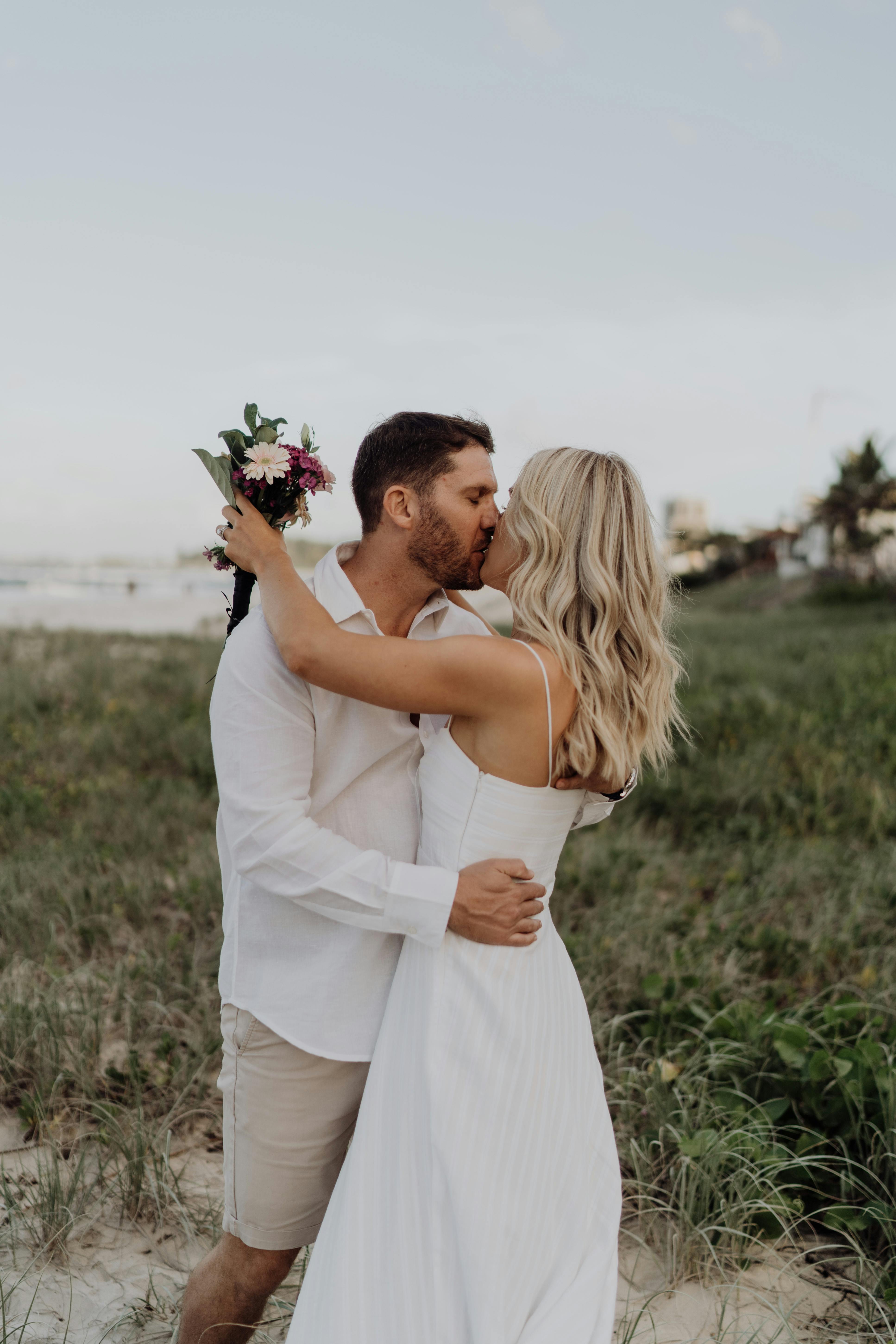 Romantic Couple at the Beach Photo Shoot · Free Stock Photo