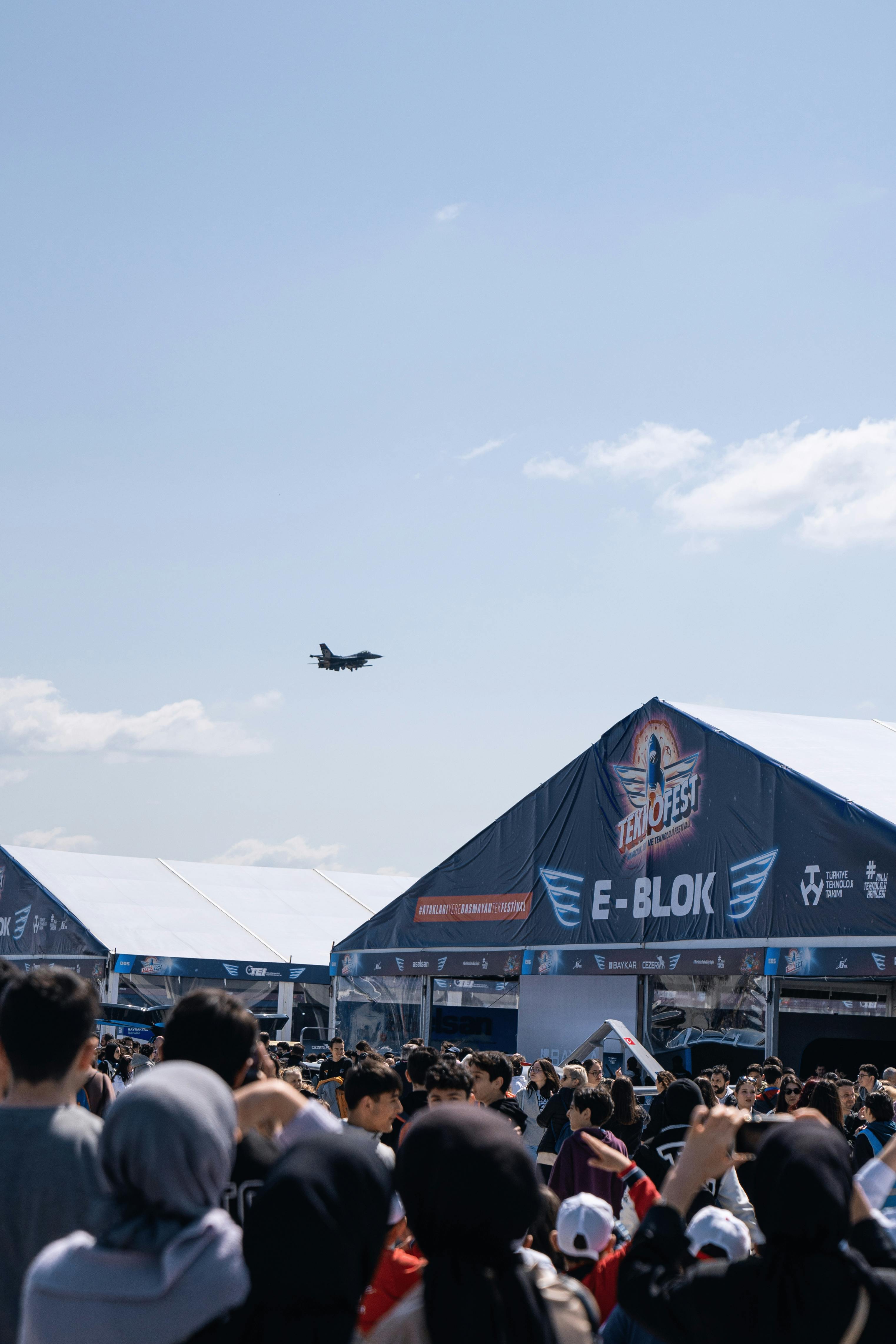 Crowd of People at a Festival, and a Jet Plane in the Sky · Free Stock ...